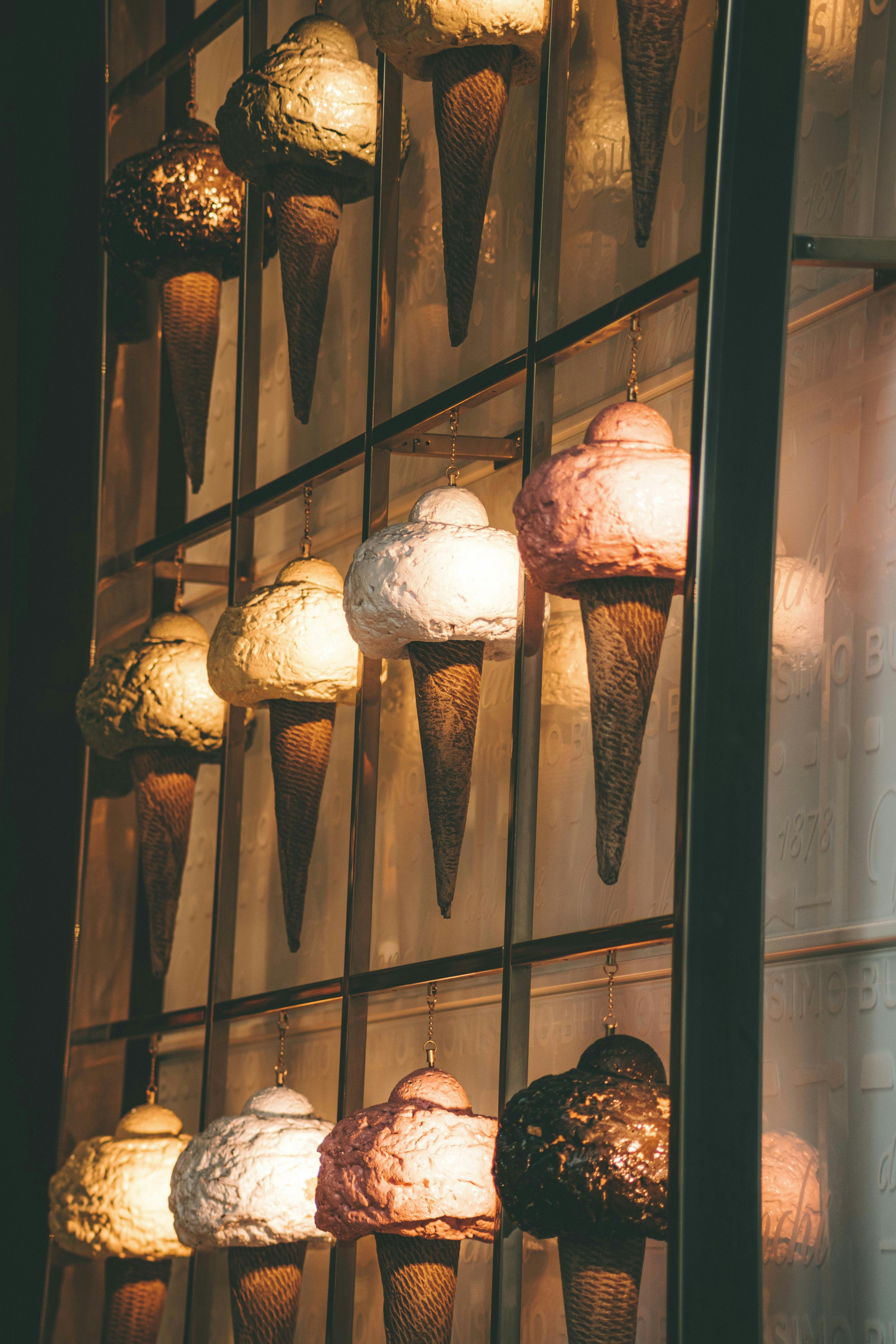 Luminous Cones in a Glass Grid: Warmth and Color in a Storefront Display