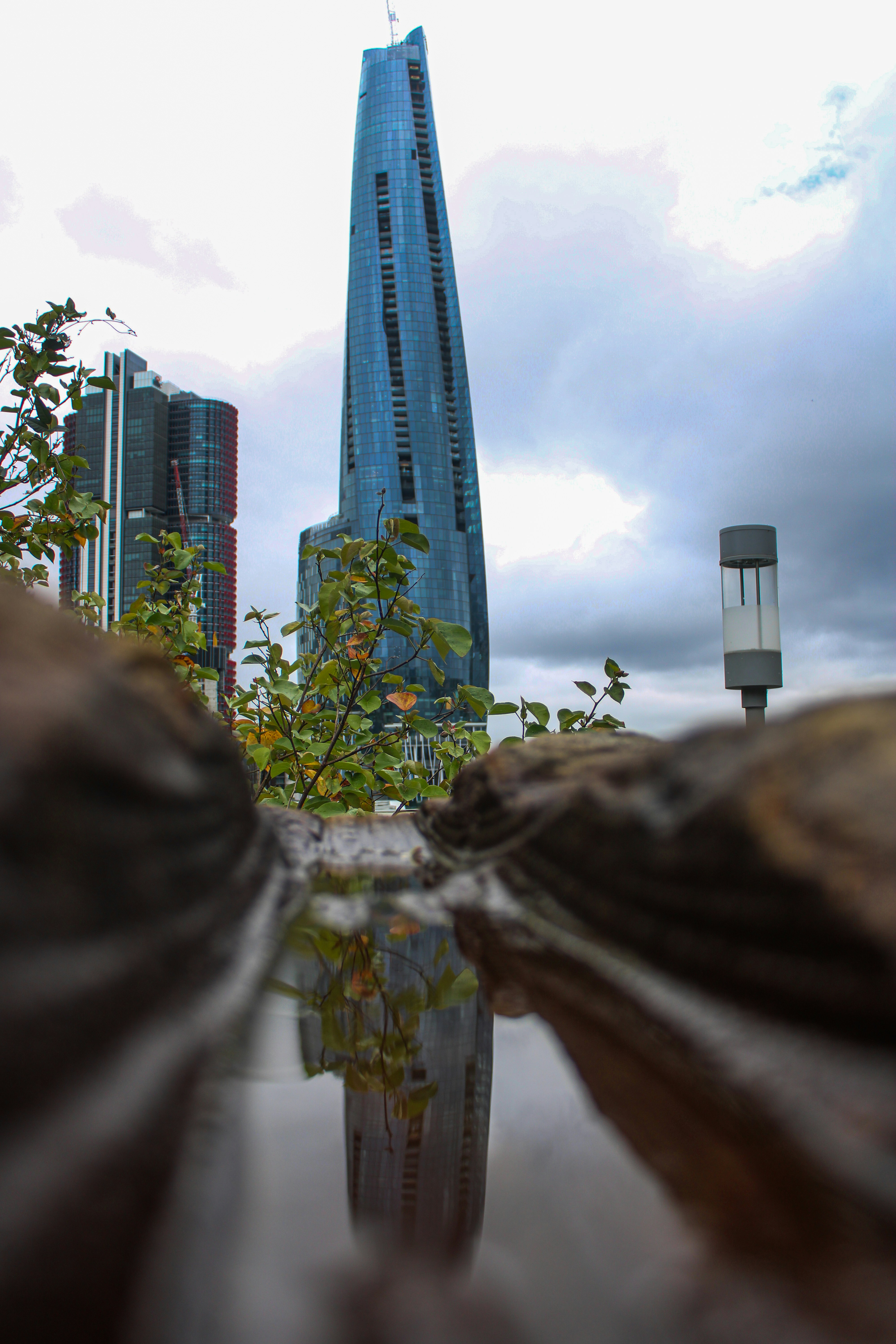Sky-Reflecting Skyline: A Tower Reaches Above the Waterfront