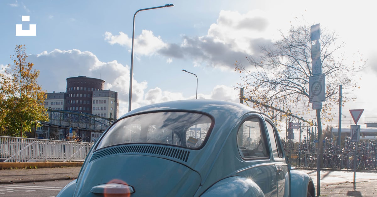 Blue Volkswagen Beetle Parked On Roadside During Daytime Photo Free