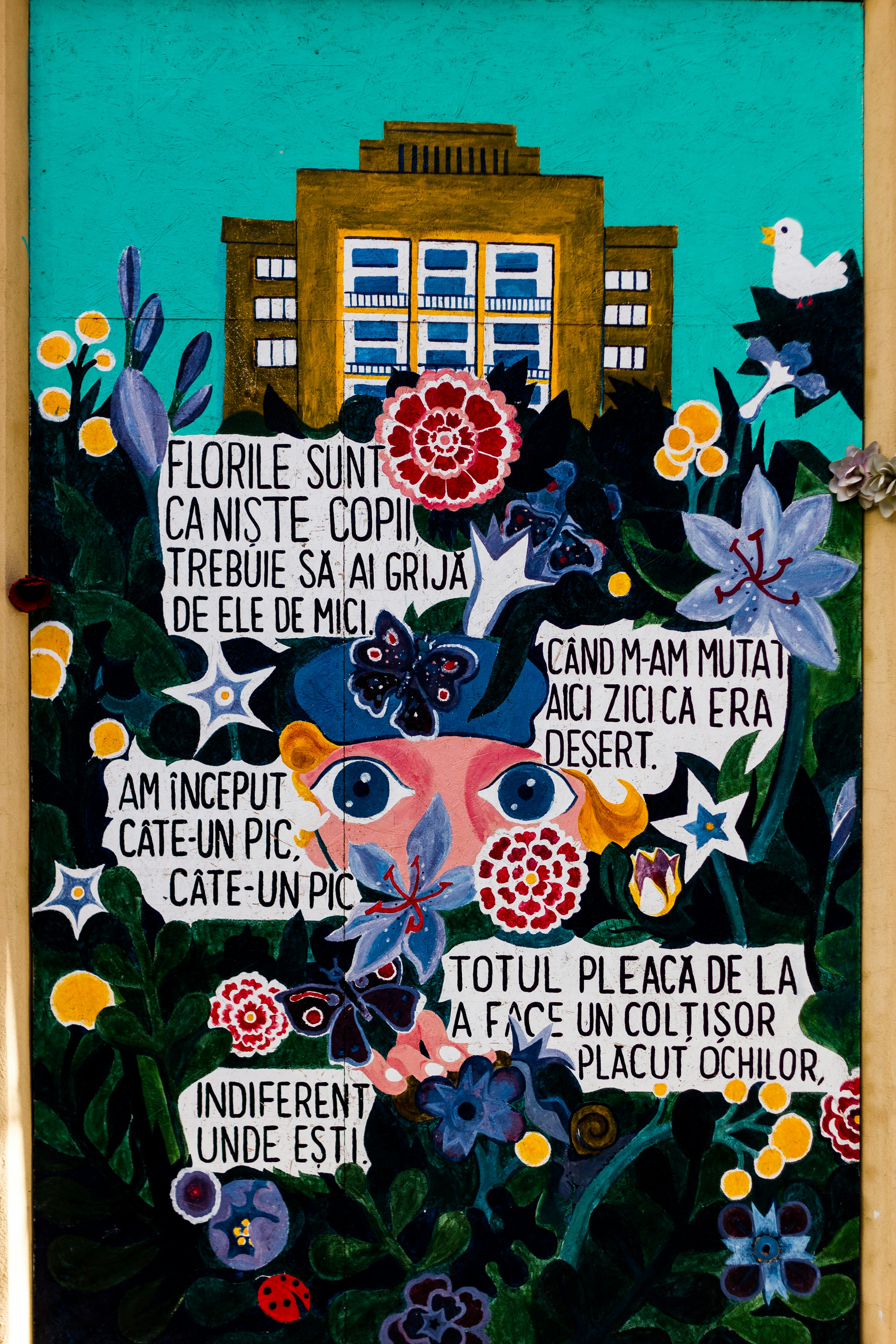 Pink Portrait in a Neon Garden: A Turquoise City Mural
