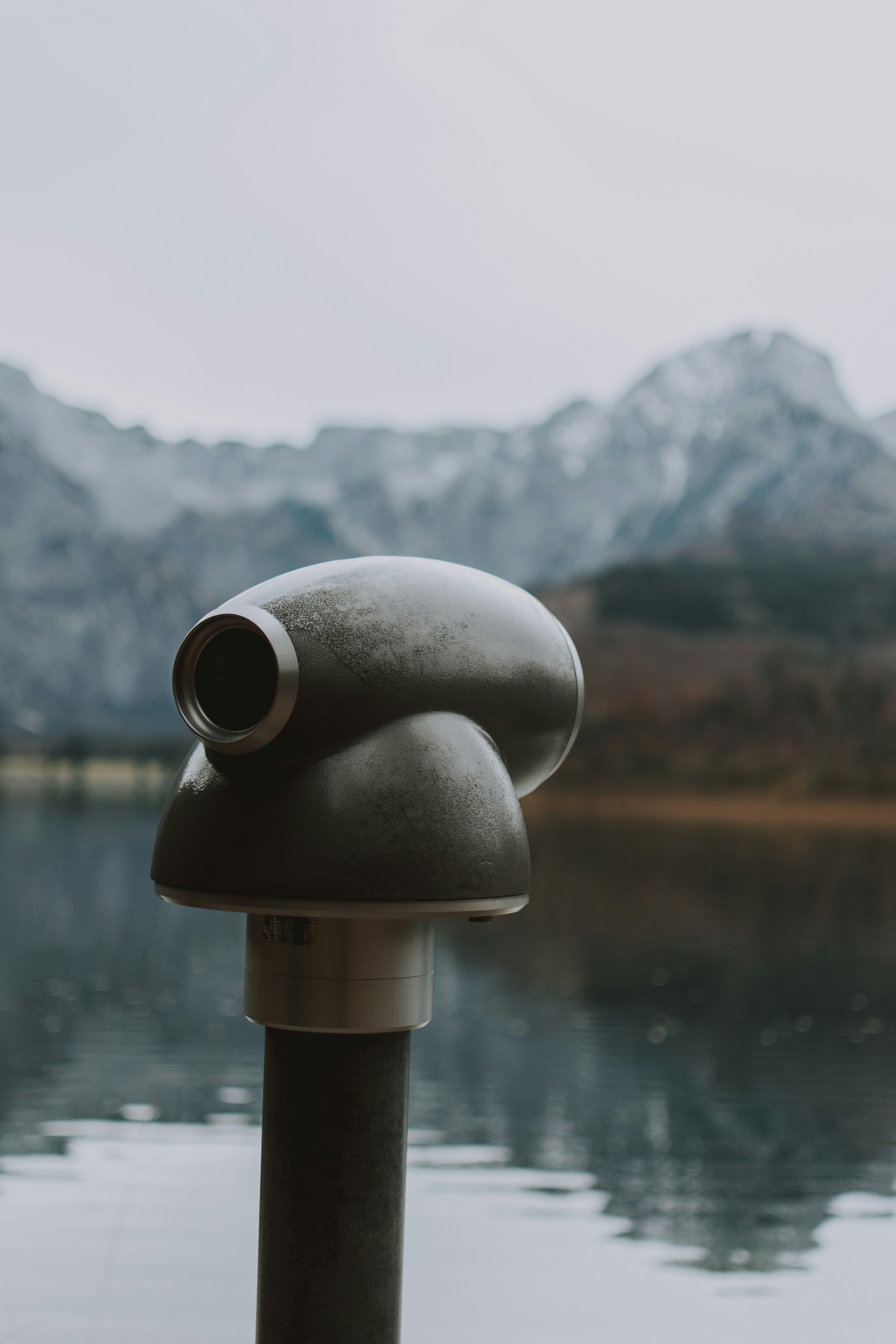 Industrial Telescope Silhouette Against Alpine Lake