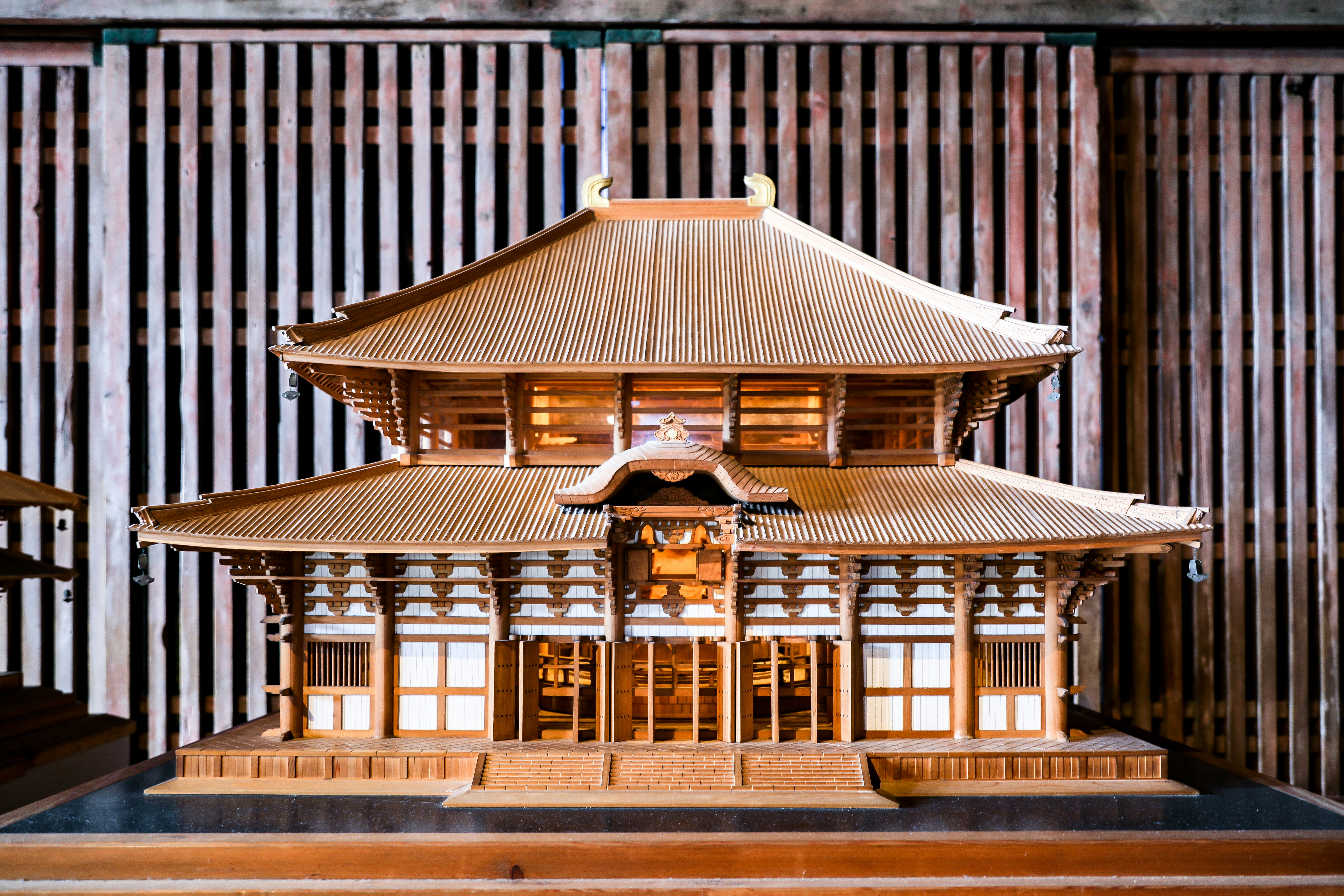 Timbered Microcosm: A Lifelike Wooden Shrine in Focus