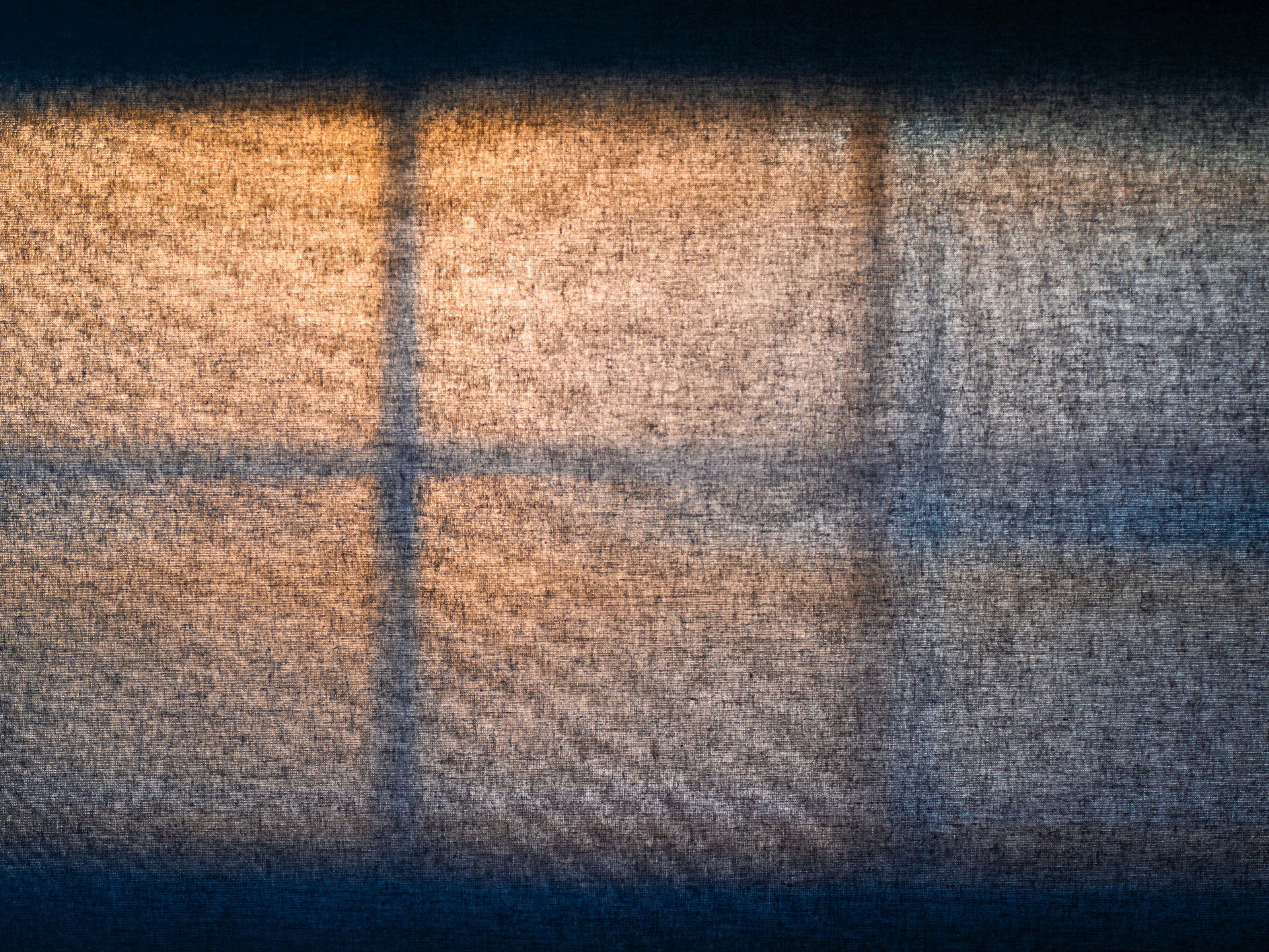 Sunlit Grid Across Textured Fabric: Warmth Meets Cool Shadow