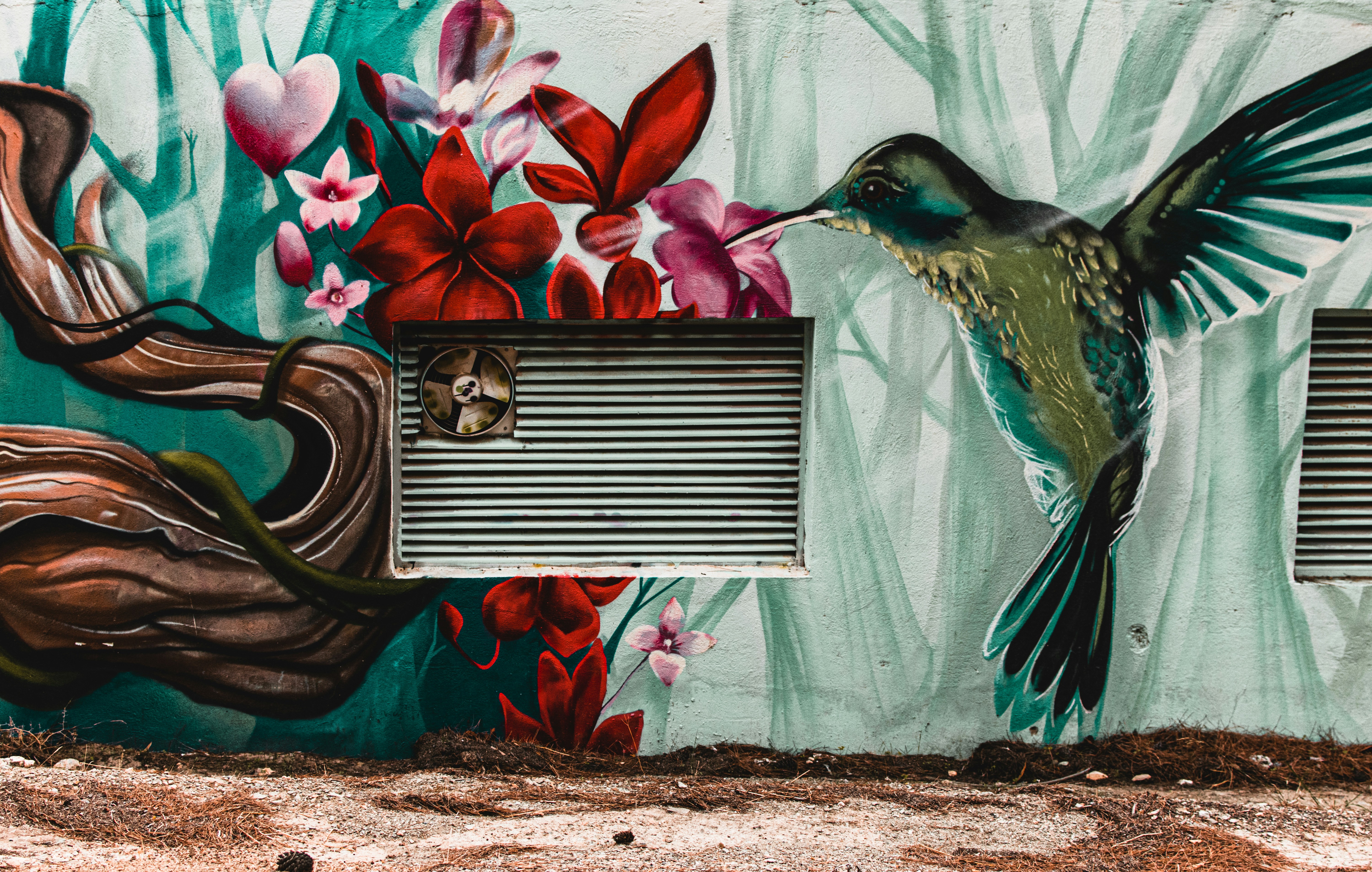 Hovering Hummingbird Over Neon Tropics on a Wall Mural