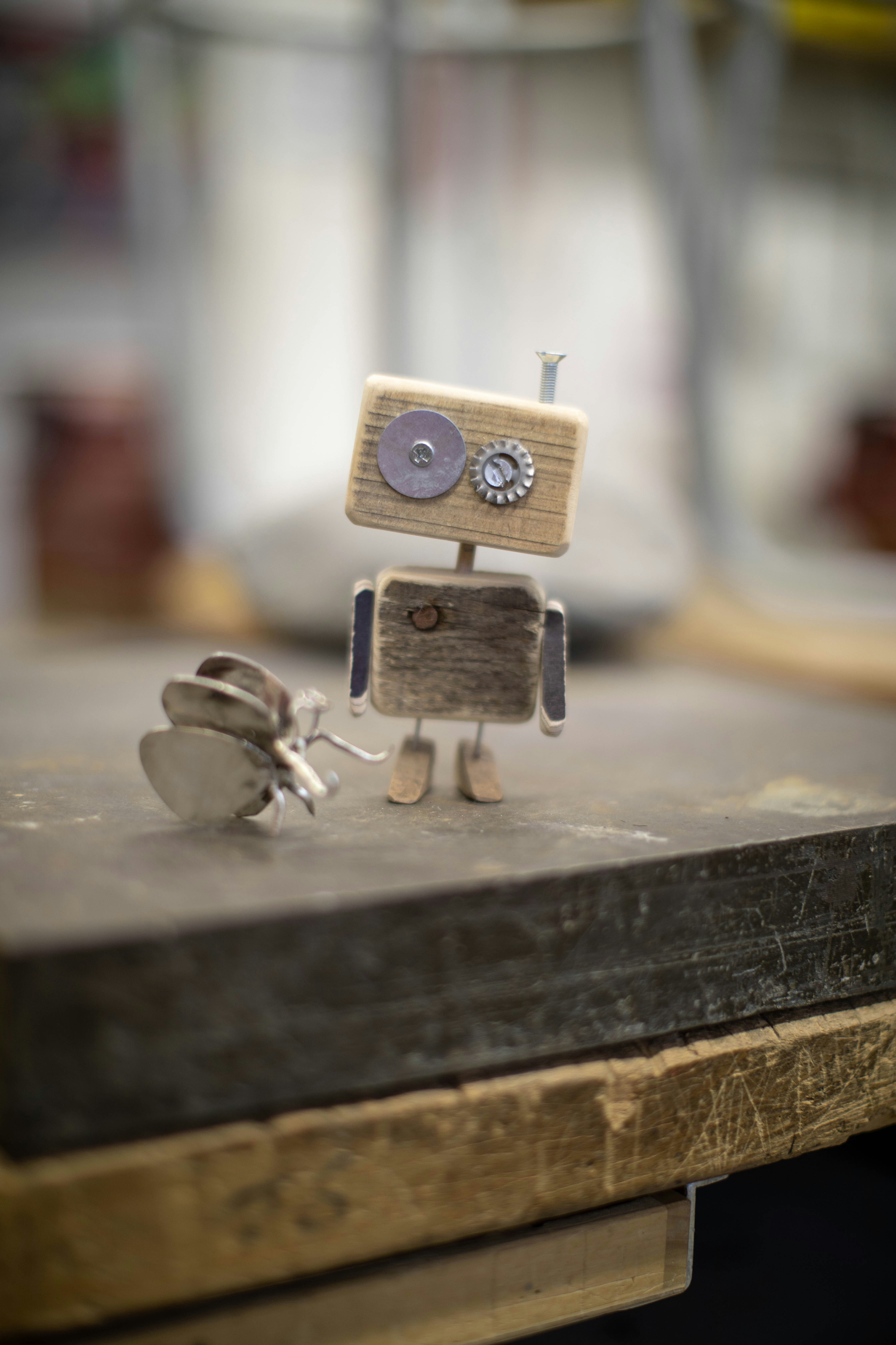 Grit and Gizmos: a Tiny Wooden Robot on a Weathered Workbench
