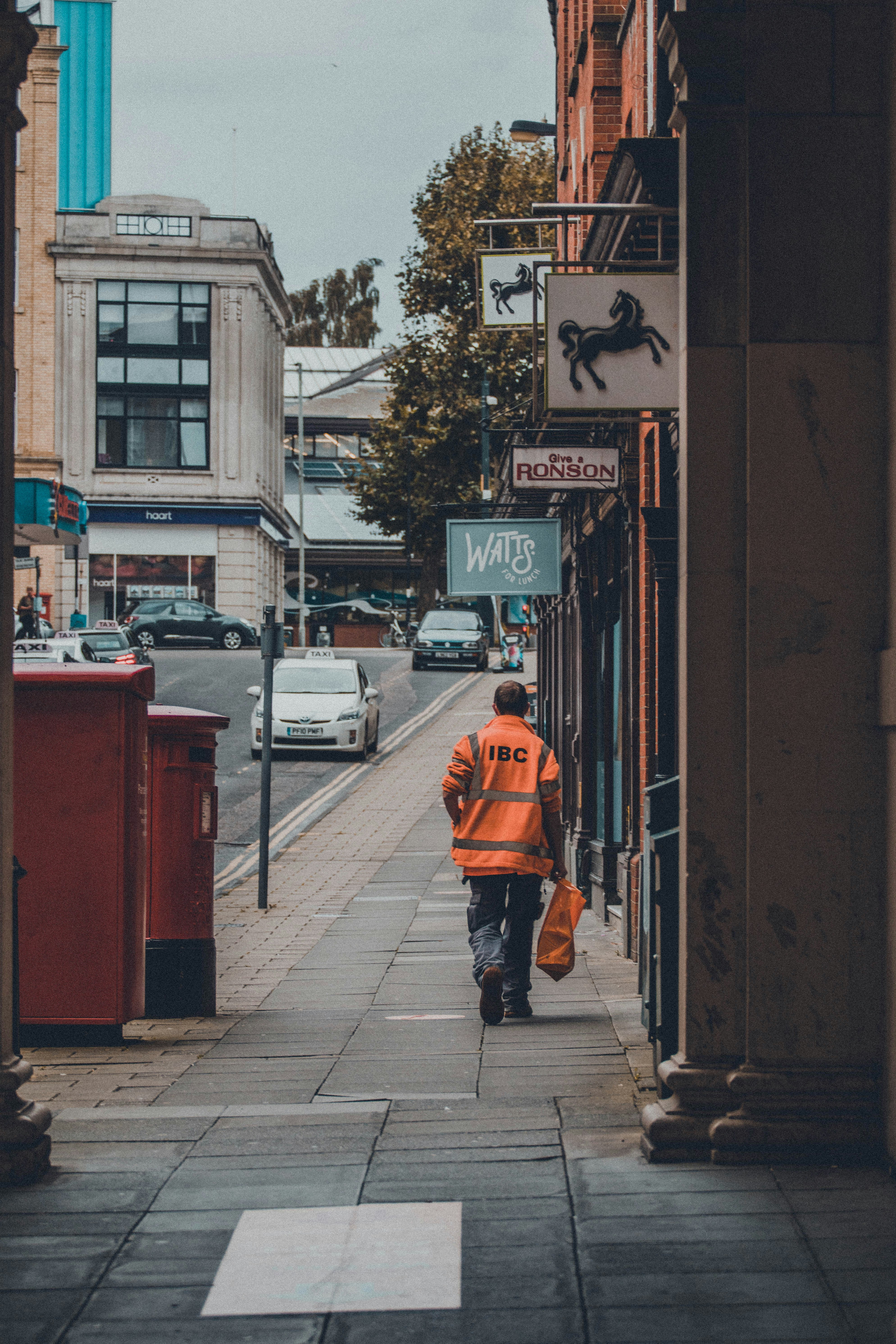 Orange-Hi-Vis Footsteps on a Quiet City Street