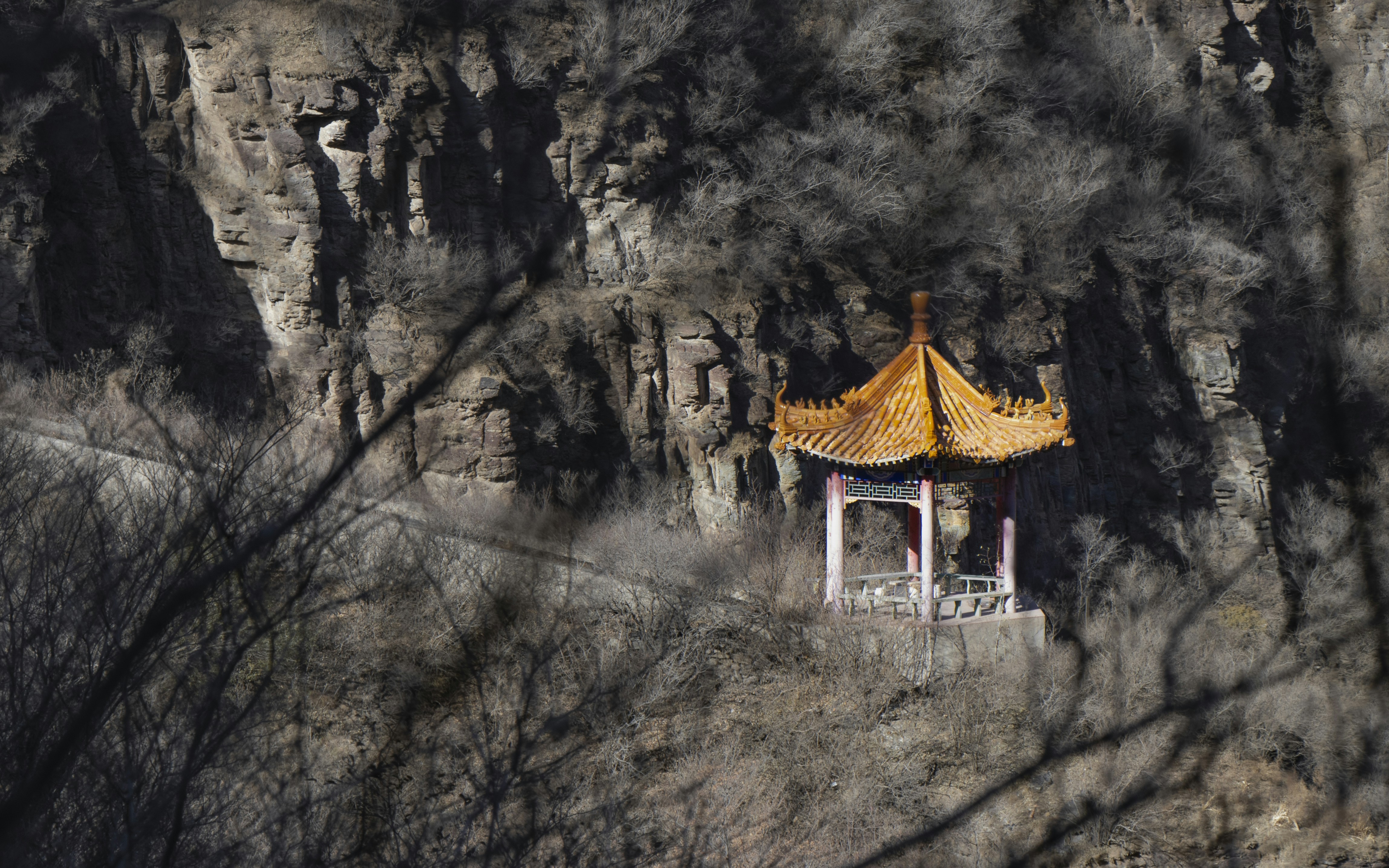 Hidden Pavilion Amid Rocky Shadows