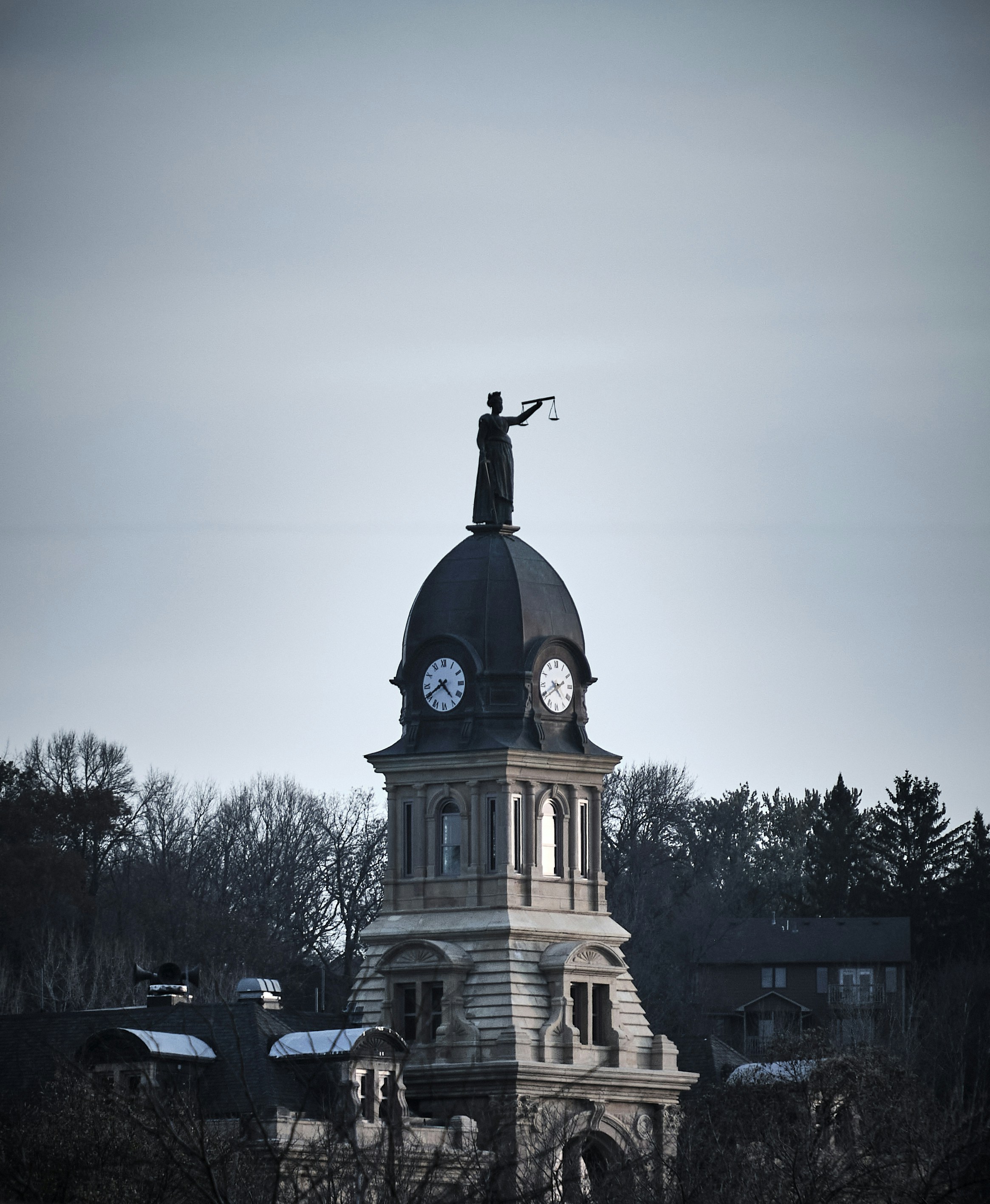 Clocktower Sentinel: A Victorian Dome Crowned by a Static Statue
