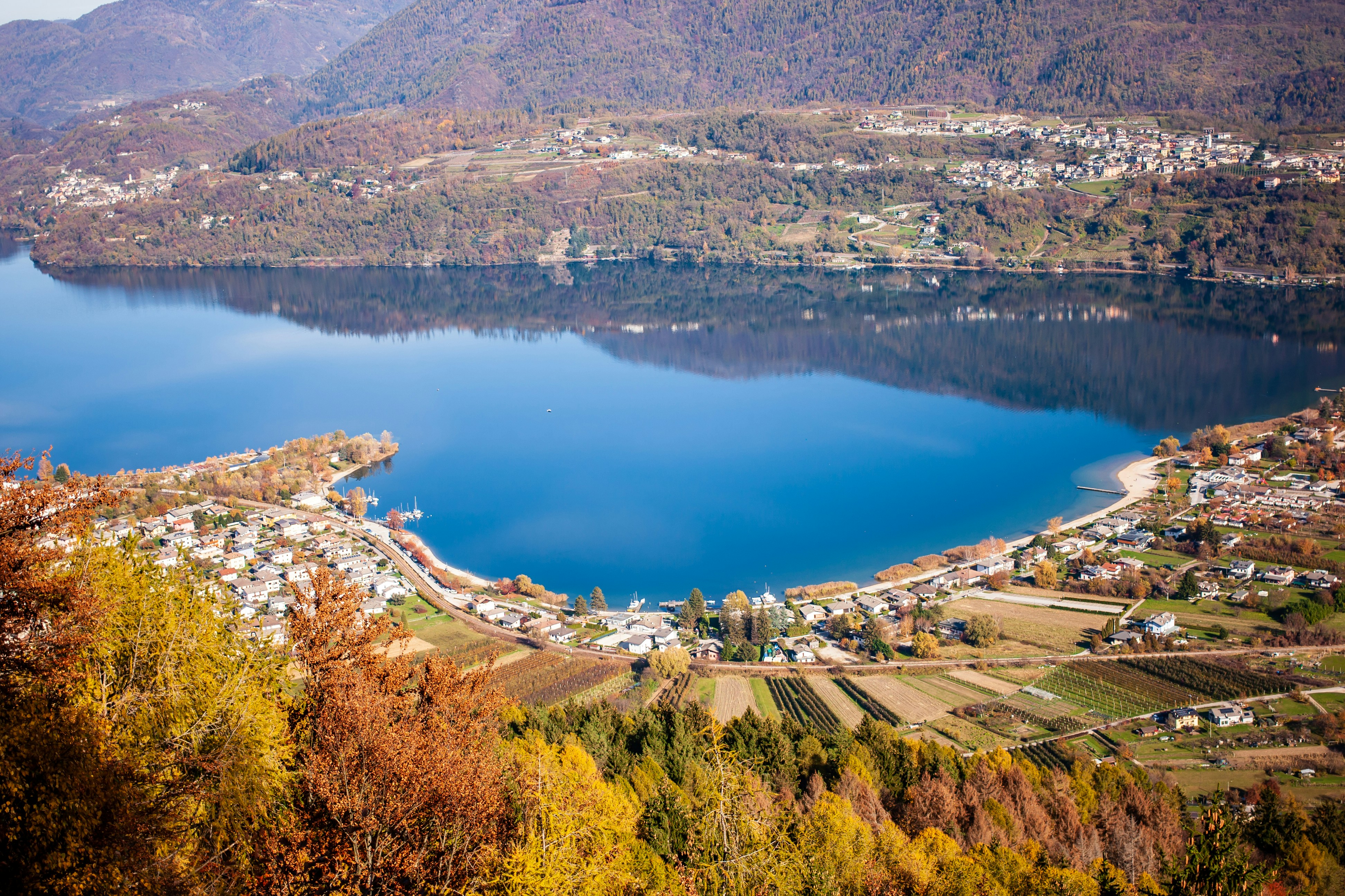 Aerial view of city near lake during daytime photo – Free Caldonazzo ...