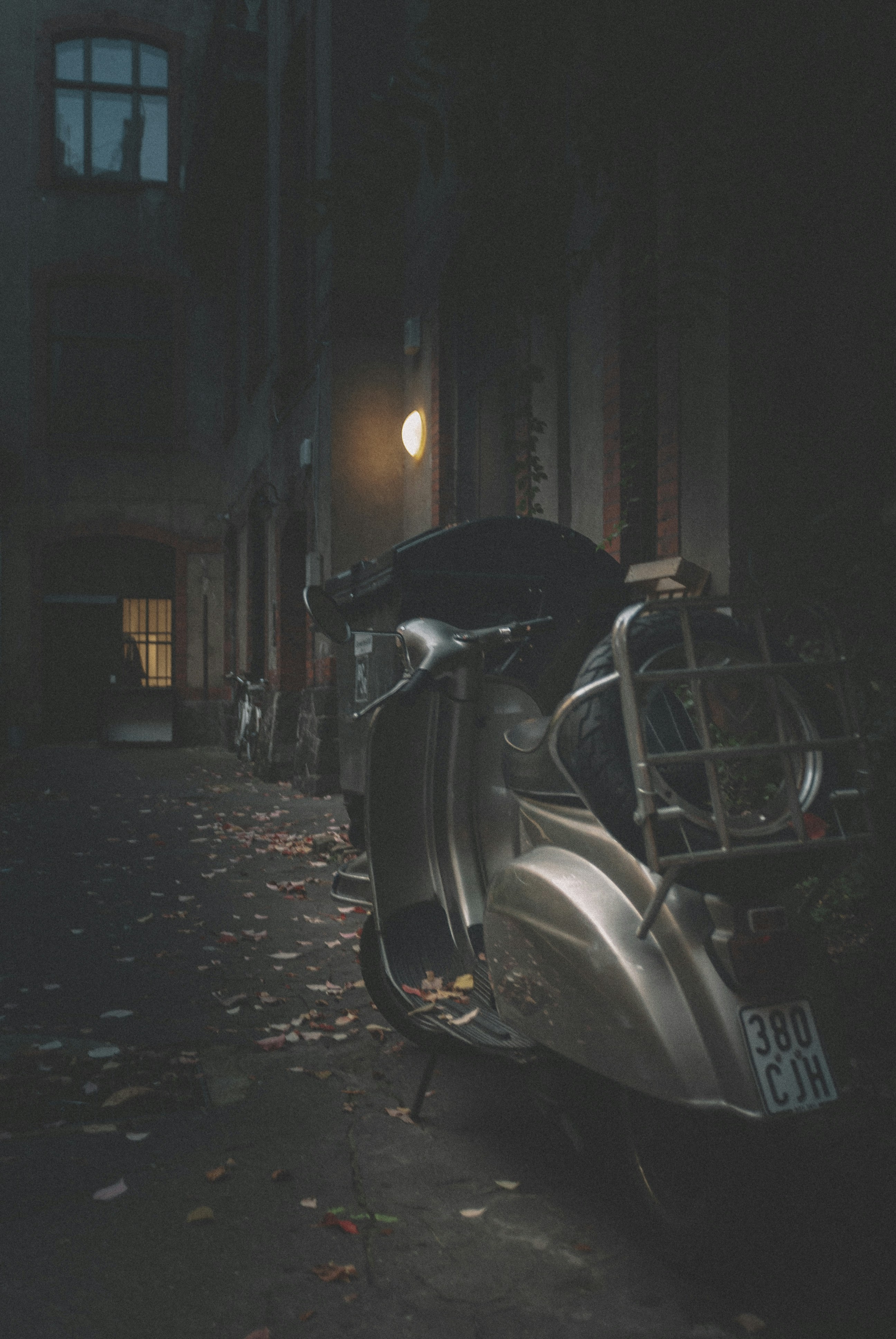 Nightfall Vespa by a Lamp: Echo in a Narrow Alley