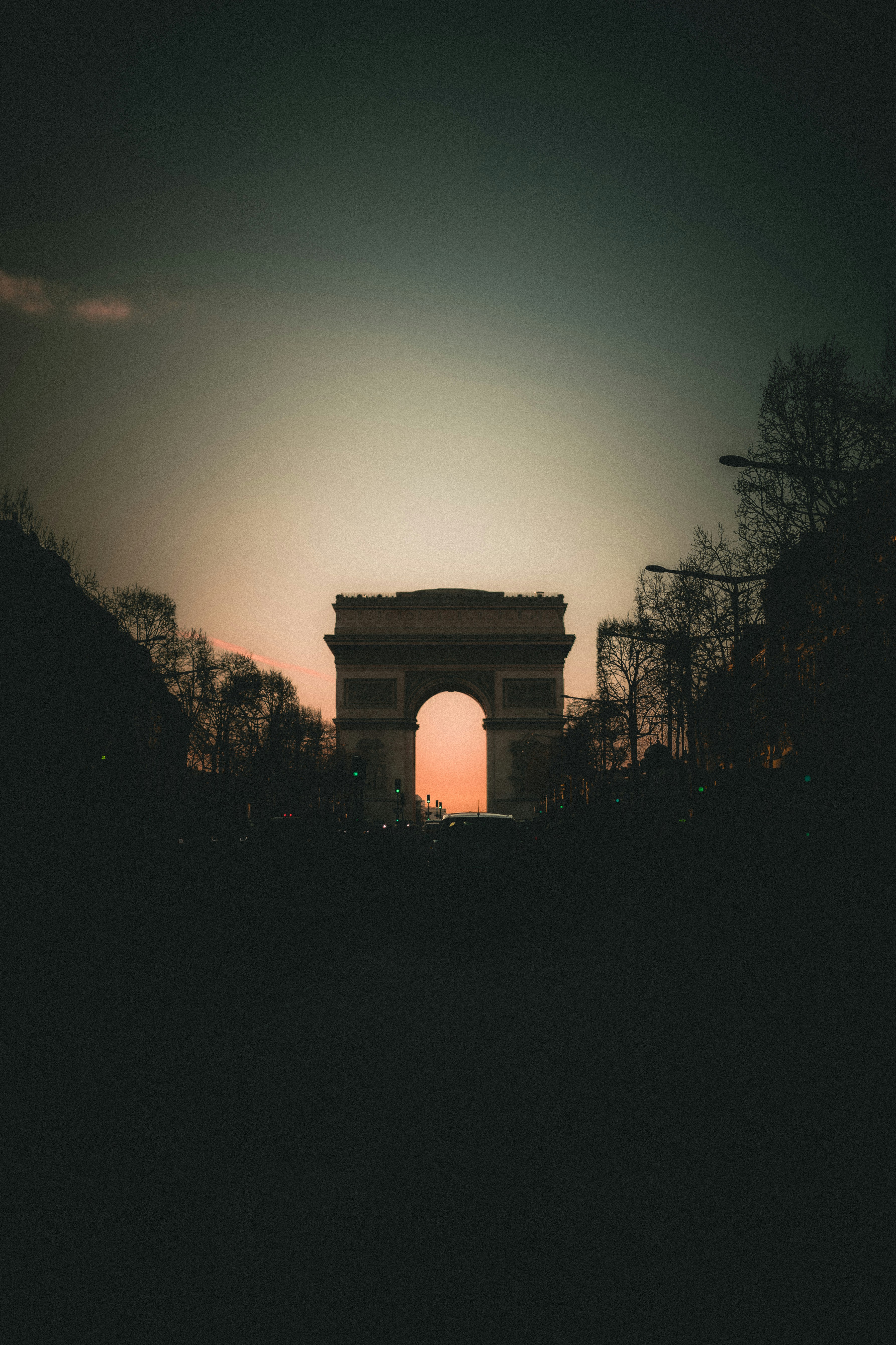 Dusk Gate: The Arc de Triomphe Framed in Quiet Avenue