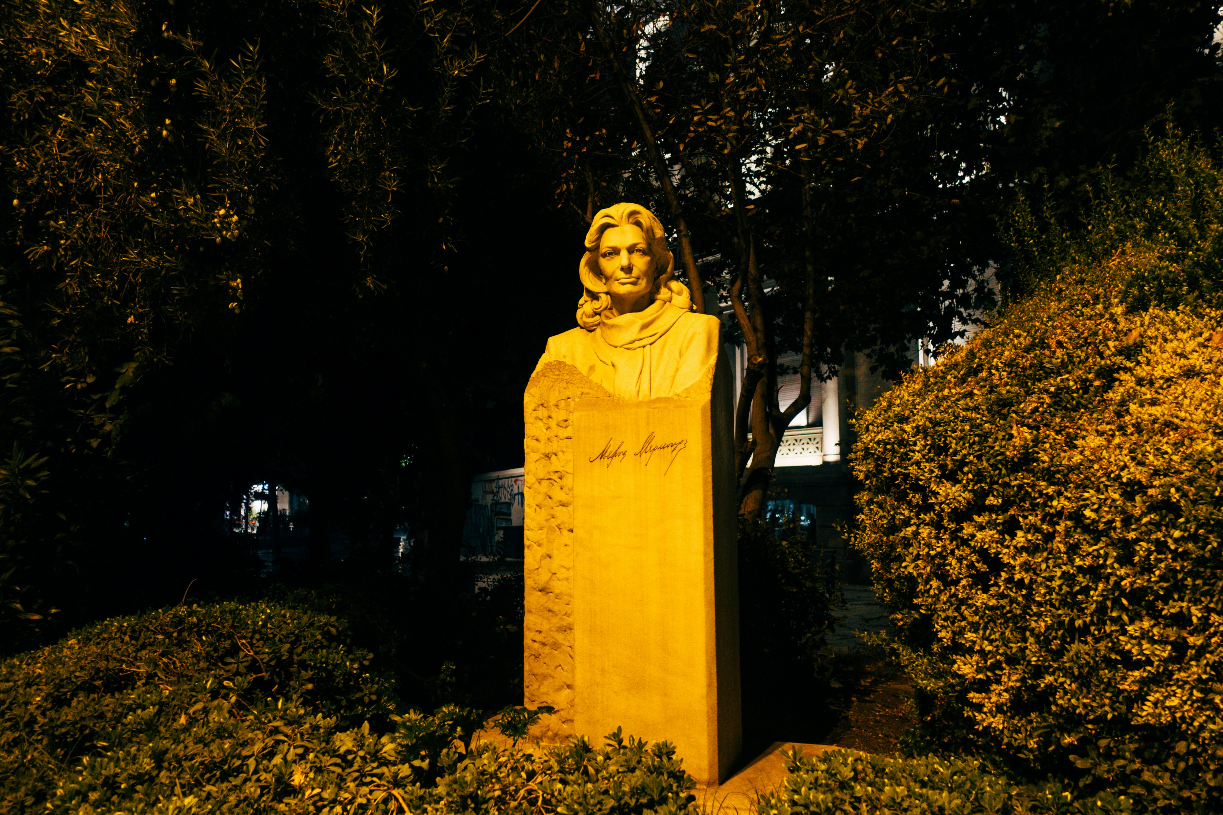 Yellow statue near green trees during night time photo – Free Art Image ...