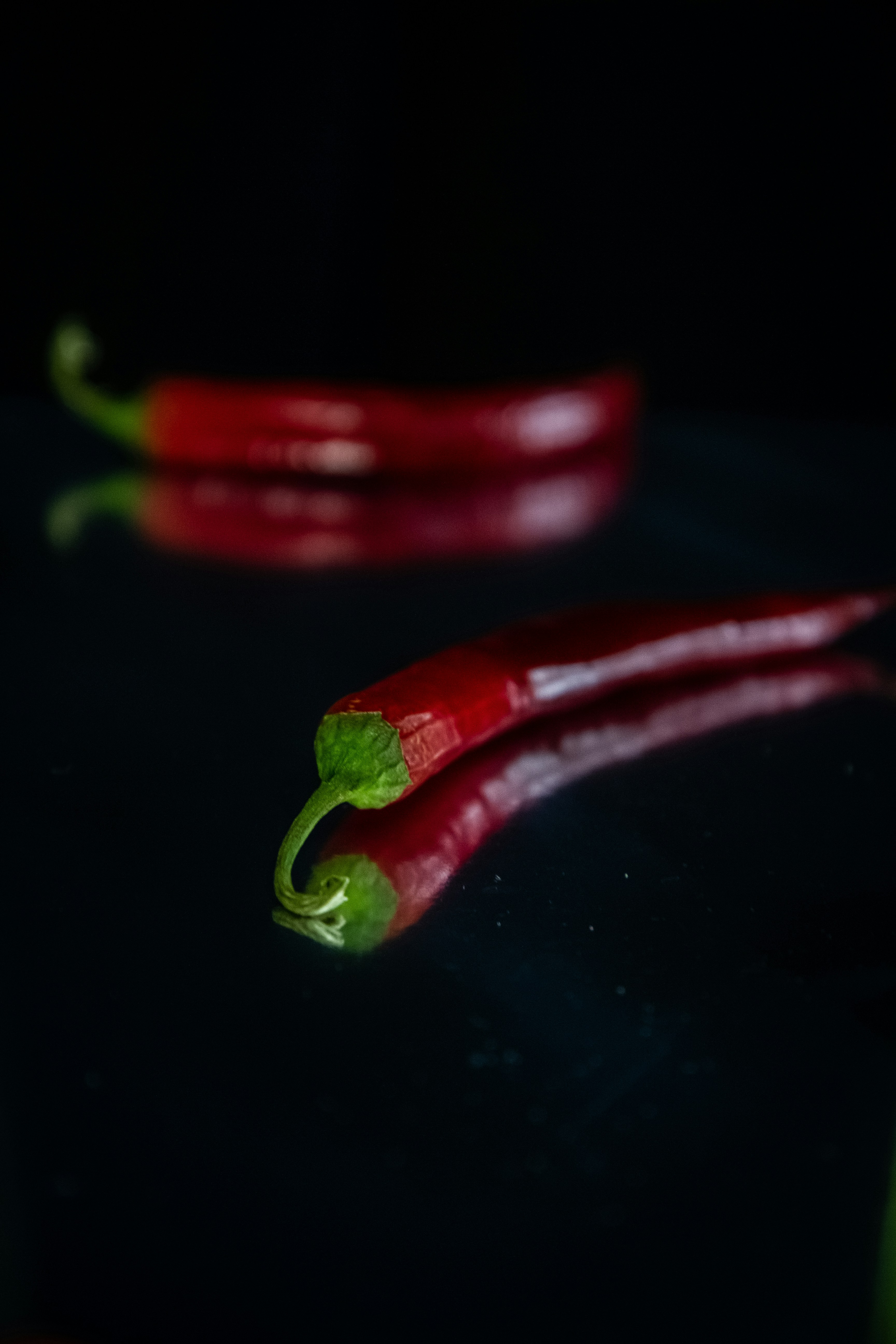 Red chili pepper on black surface photo – Free Food Image on Unsplash