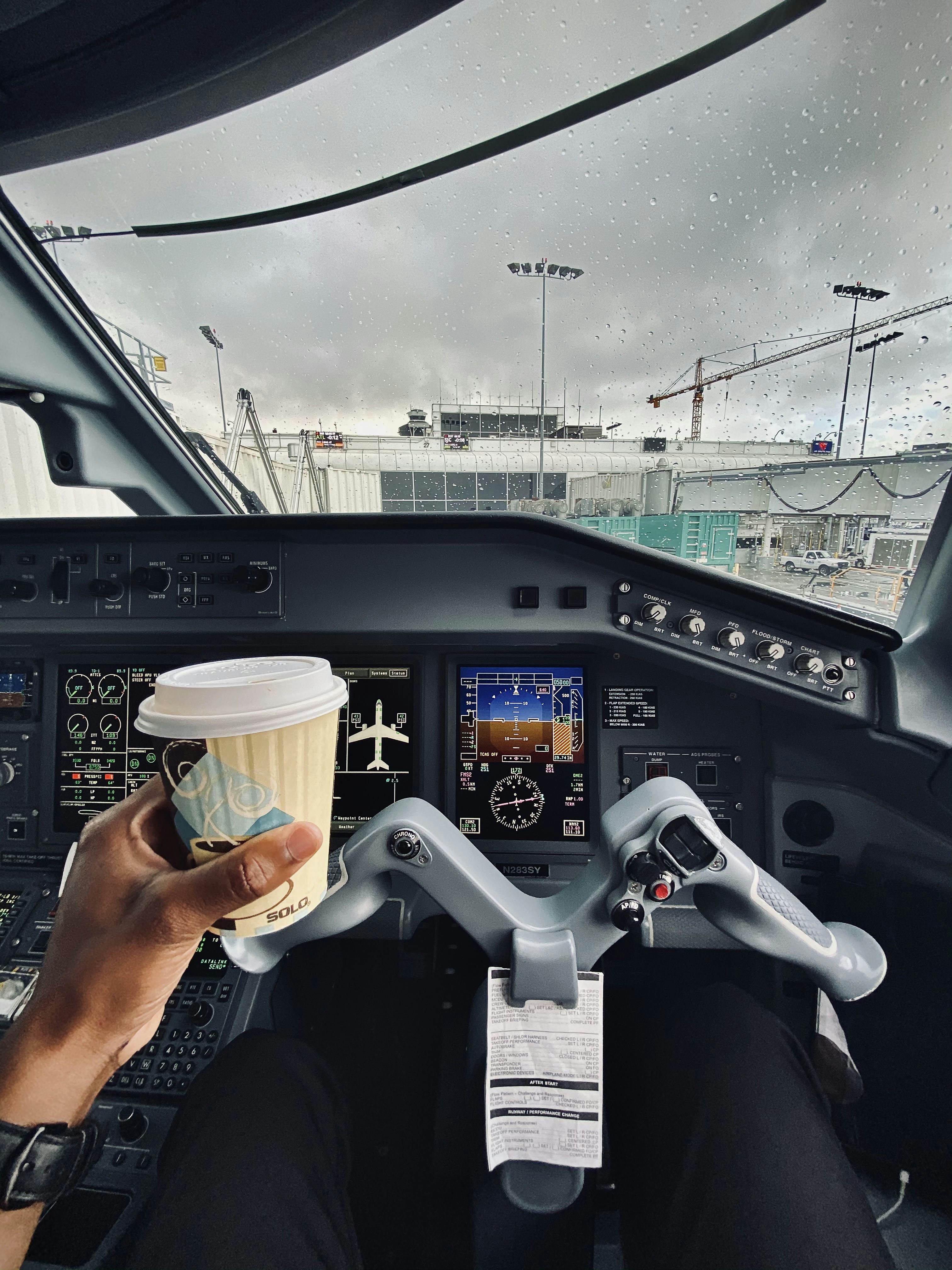 Cup at the Console: A Quiet Moment in the Flight Deck