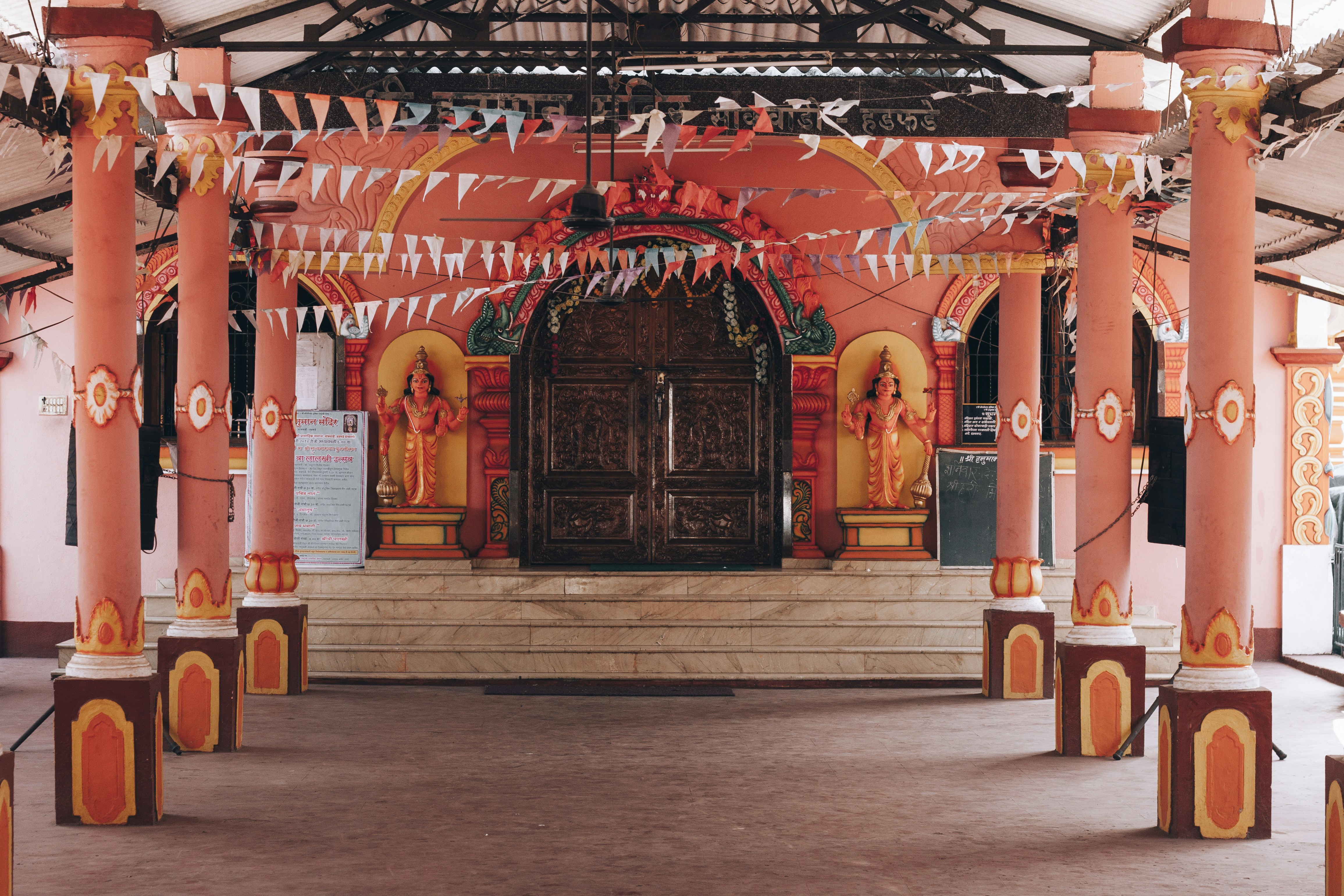 Bannered Corridor to the Sacred Carved Door