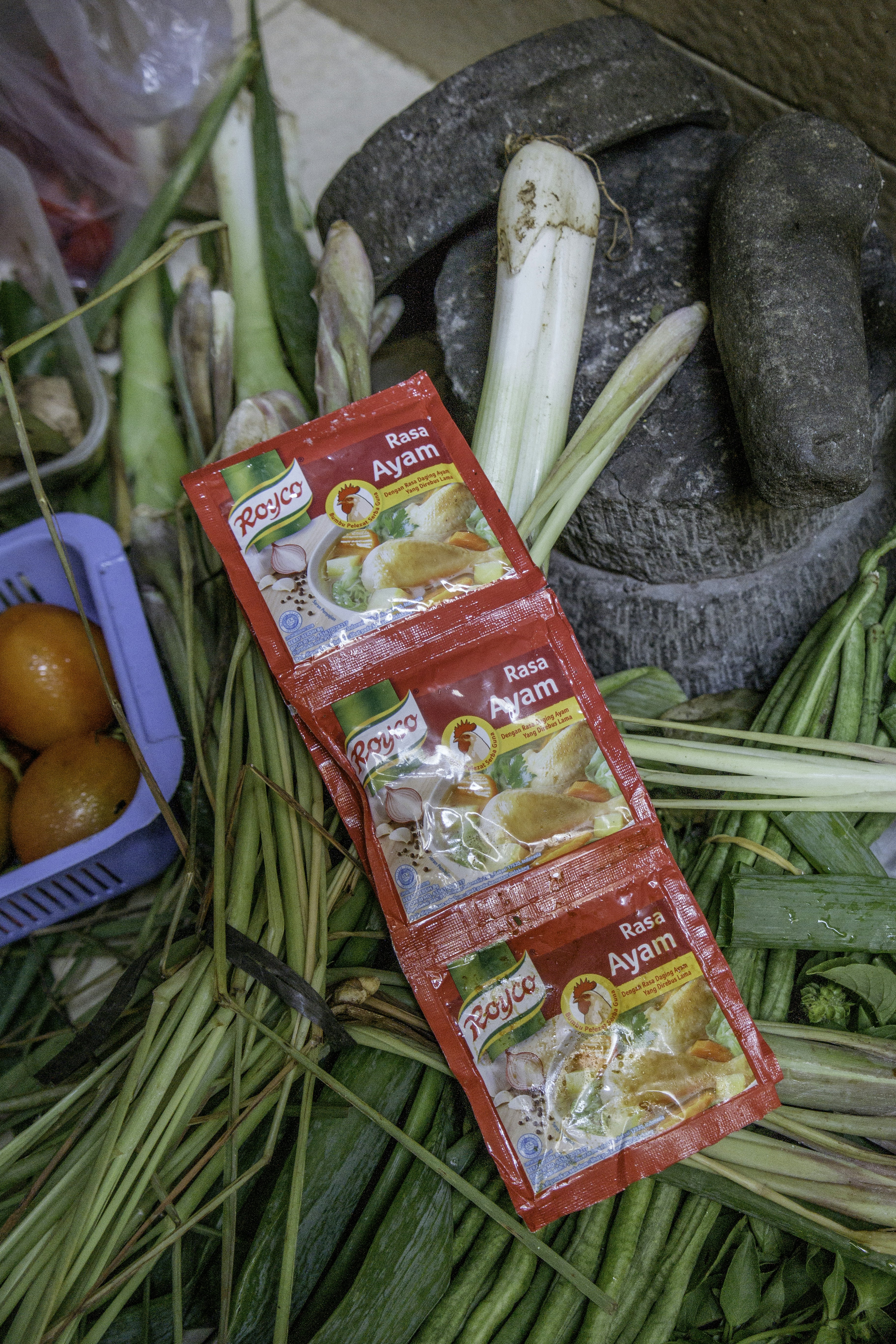 Red-Packaged Flavor: Three Salmon-Wrapper Pack Amid Fresh Market Greens