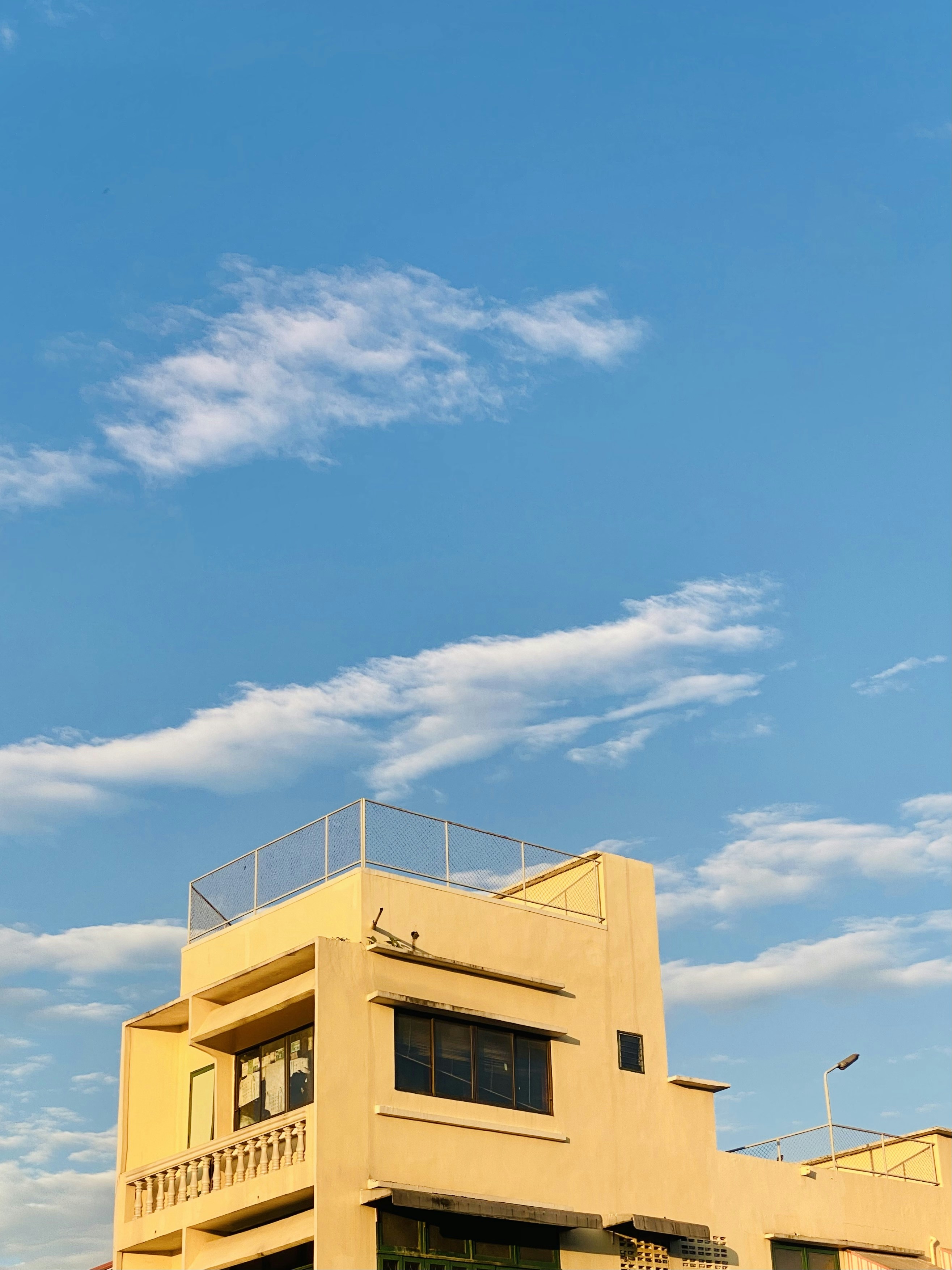 COVID-19 force us to stay at home. No travel. But it can’t stop us from creating nice pictures | yellow concrete building under blue sky during daytime
