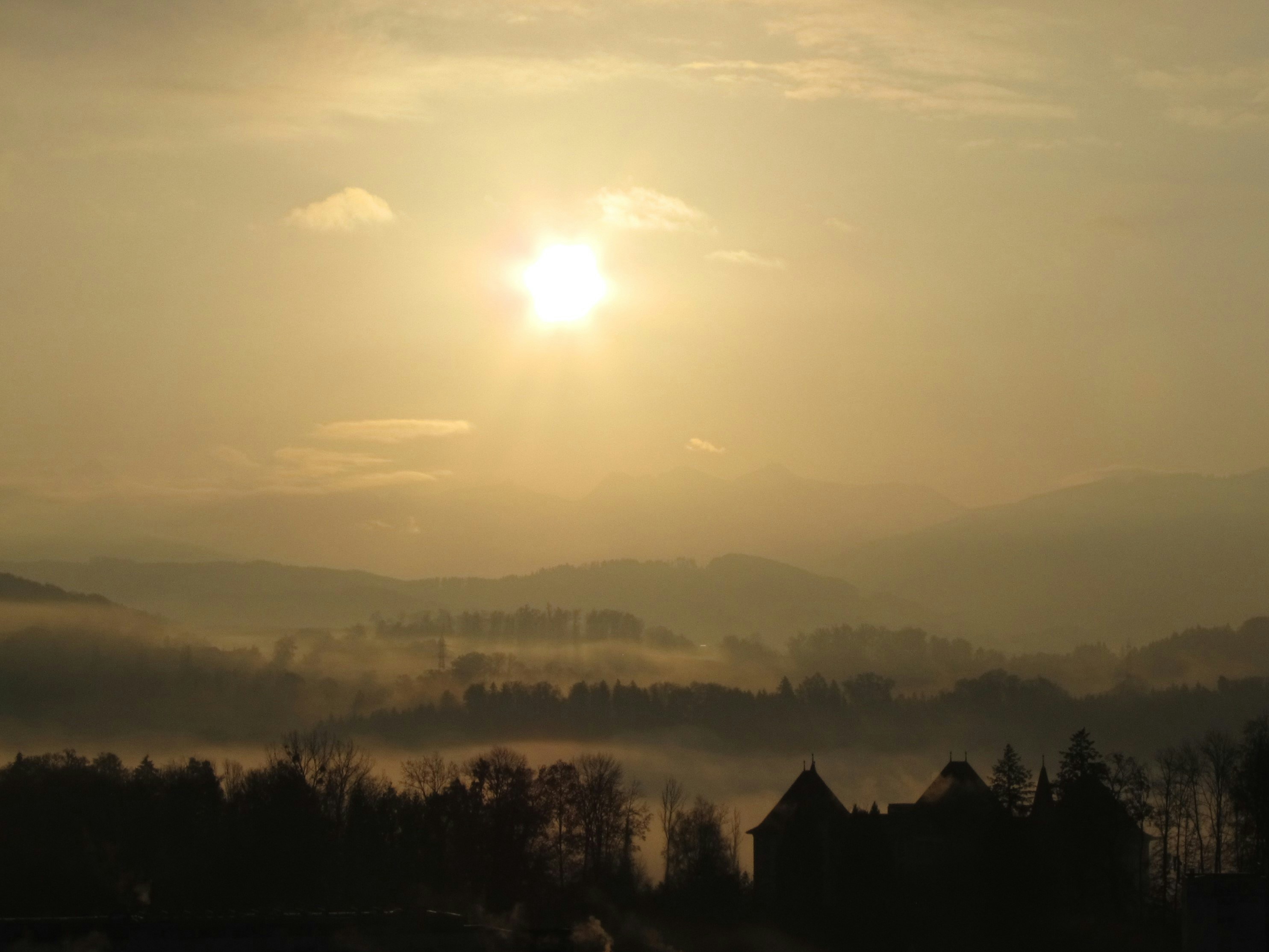 Dawn Over Mist-Wrapped Valley