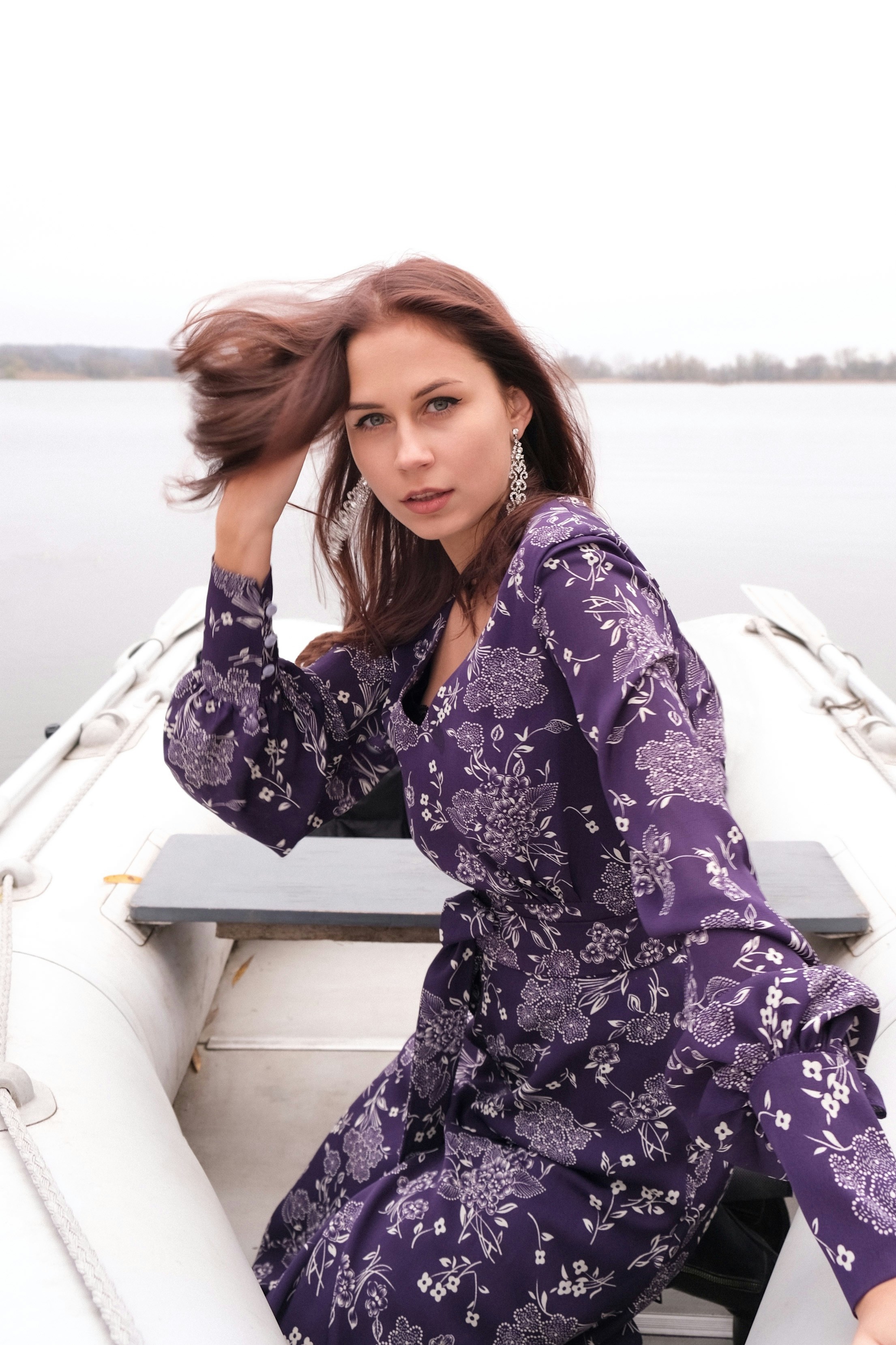Wind-Kissed Portrait Aboard a Quiet Lake