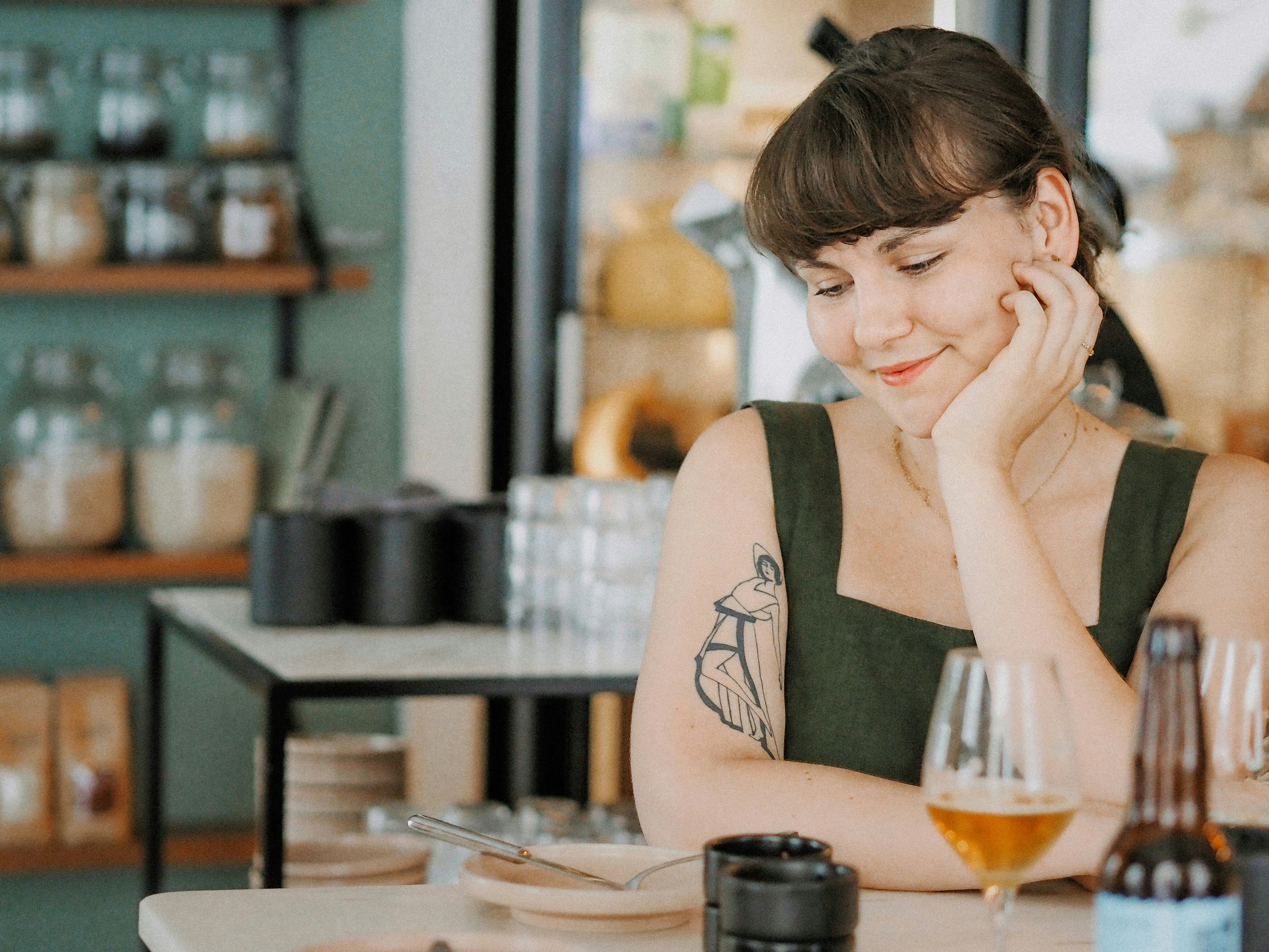 Soft Contemplation at a Café: A Portrait in Warm Light