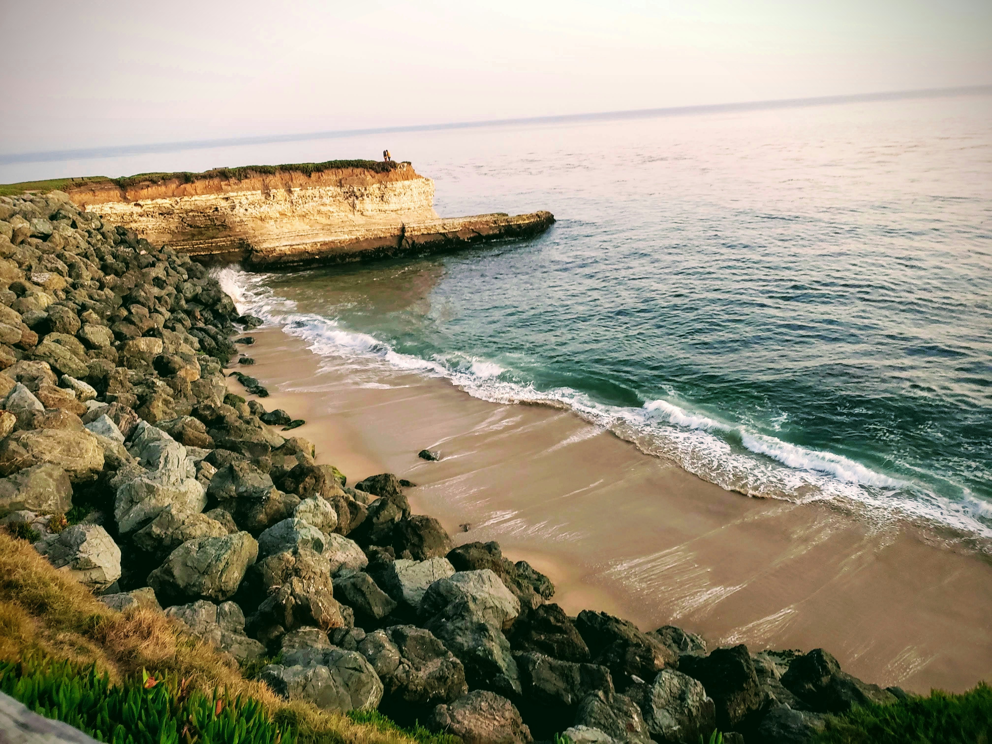 Twilight Breakwater: Granite Guardians Over a Quiet Shore