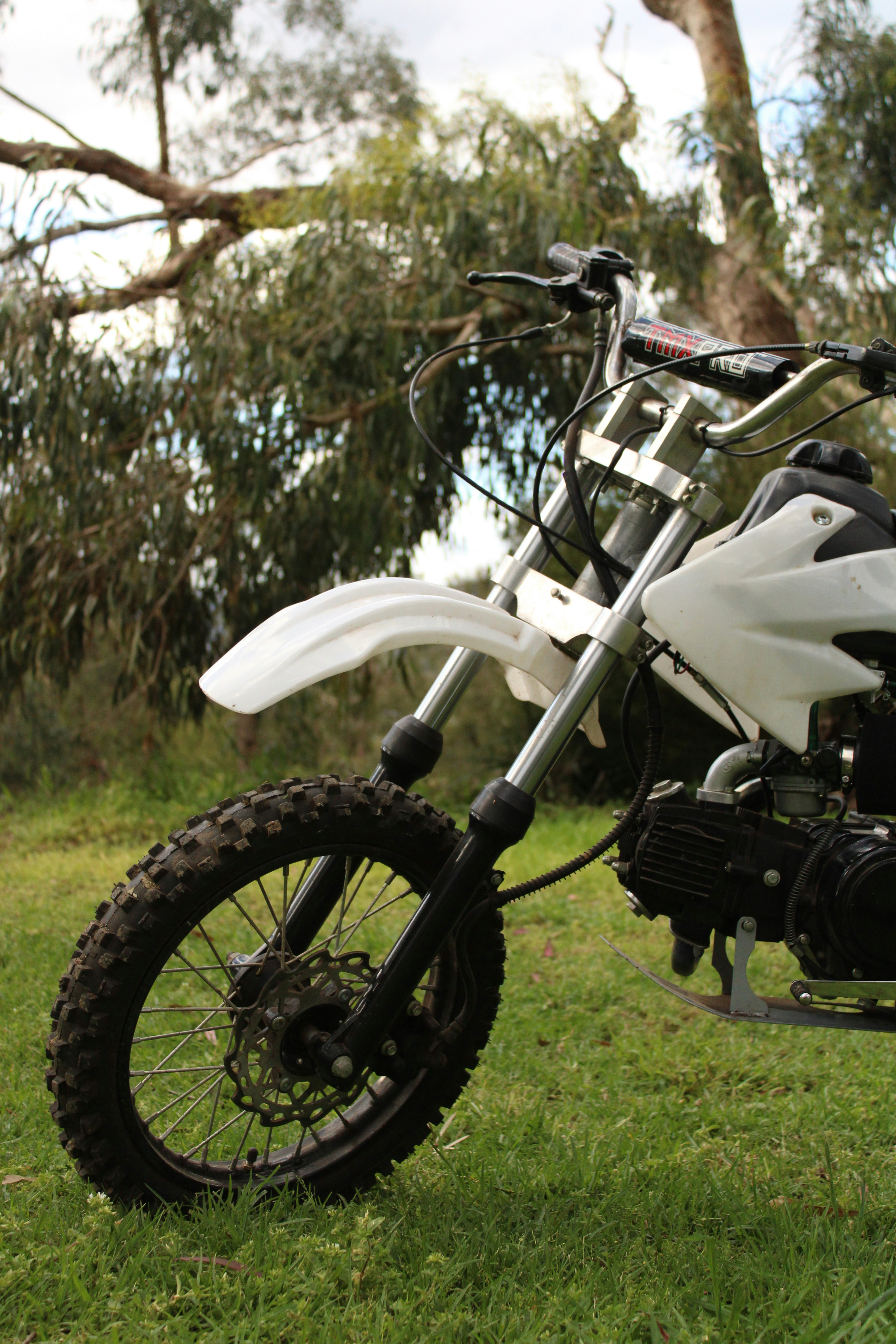 Black and gray motorcycle on green grass field during daytime photo ...