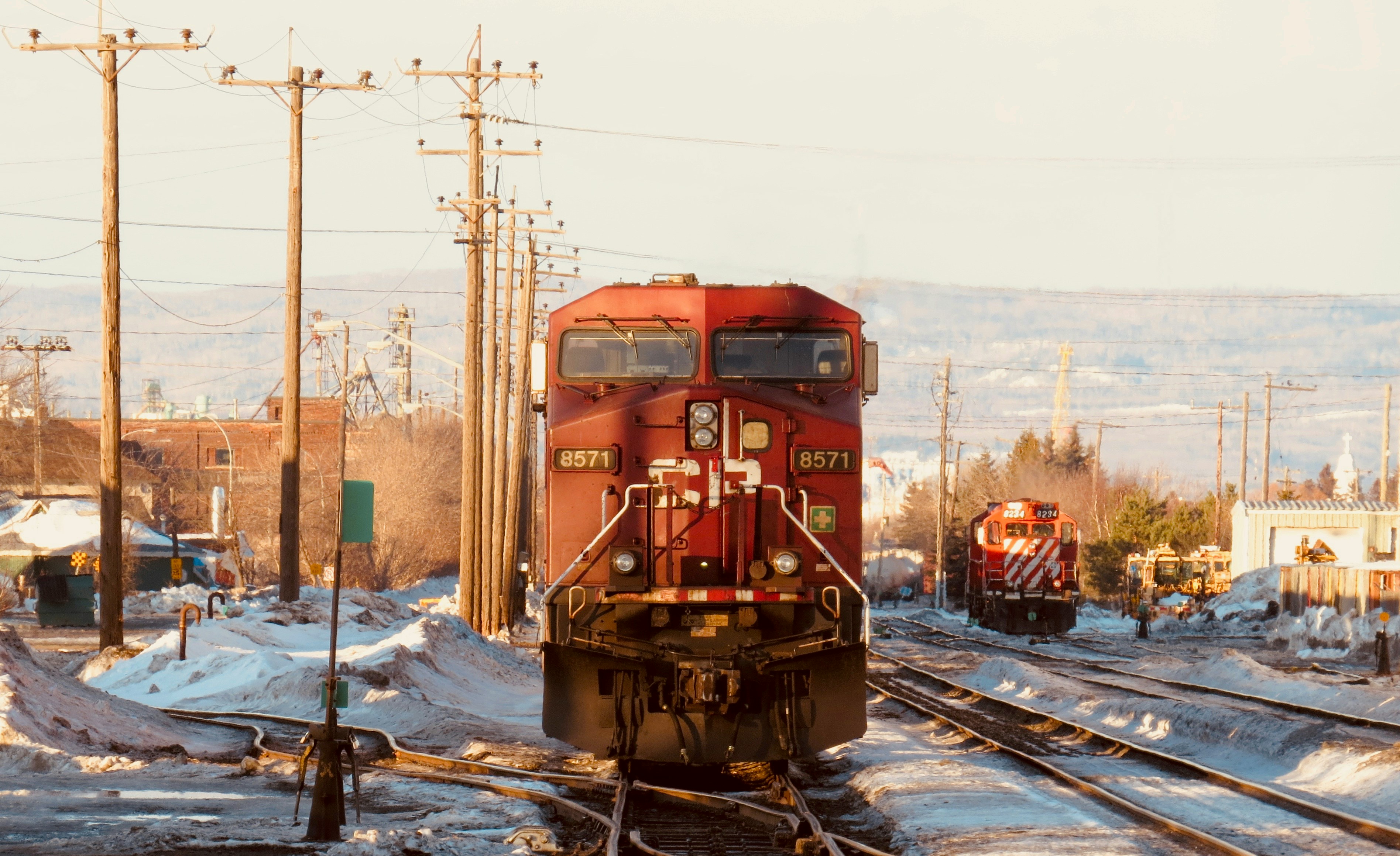 Red train on rail road covered with snow during daytime photo – Free ...