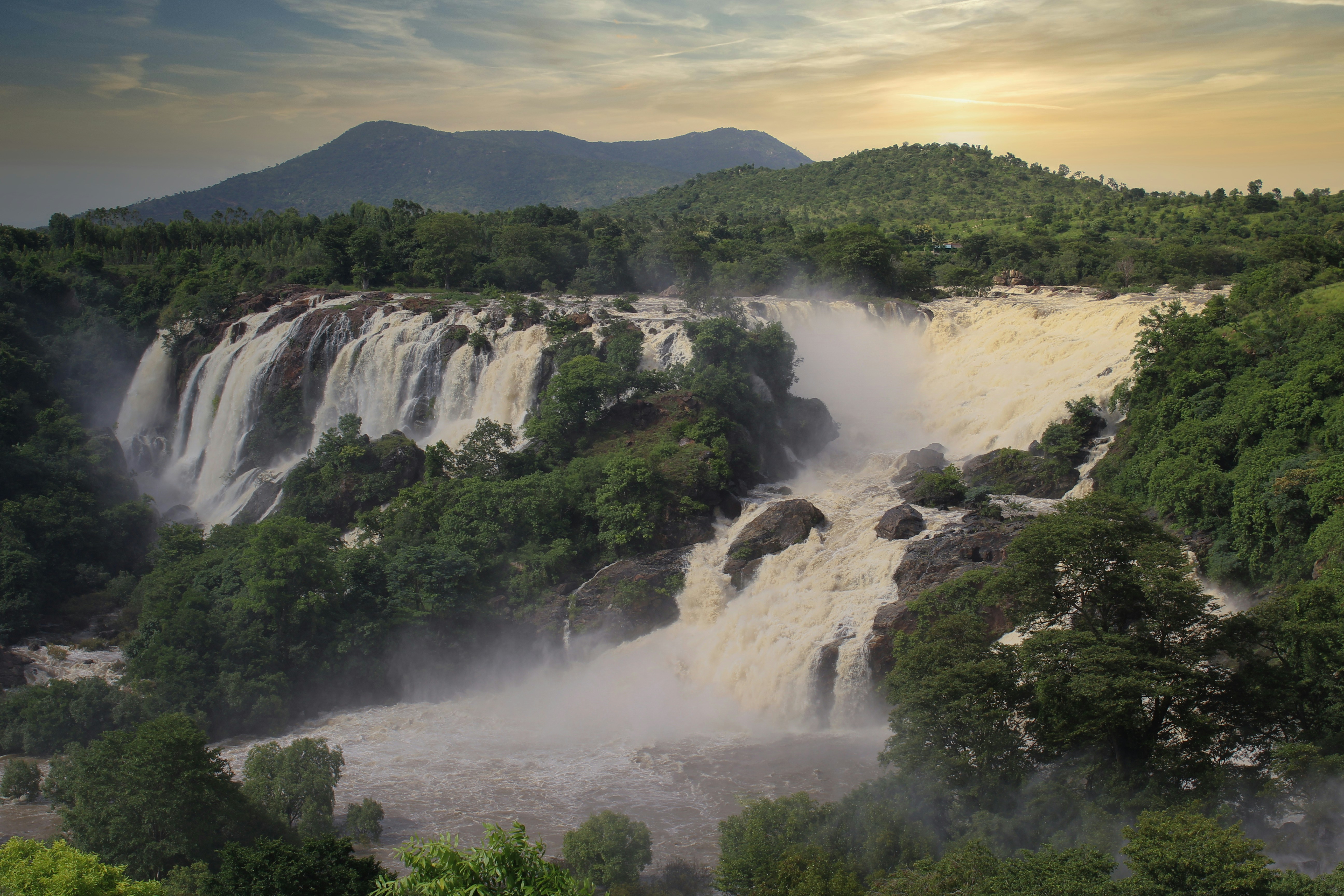 Majestic Flow of Gaganachukki Amidst Verdant Hills