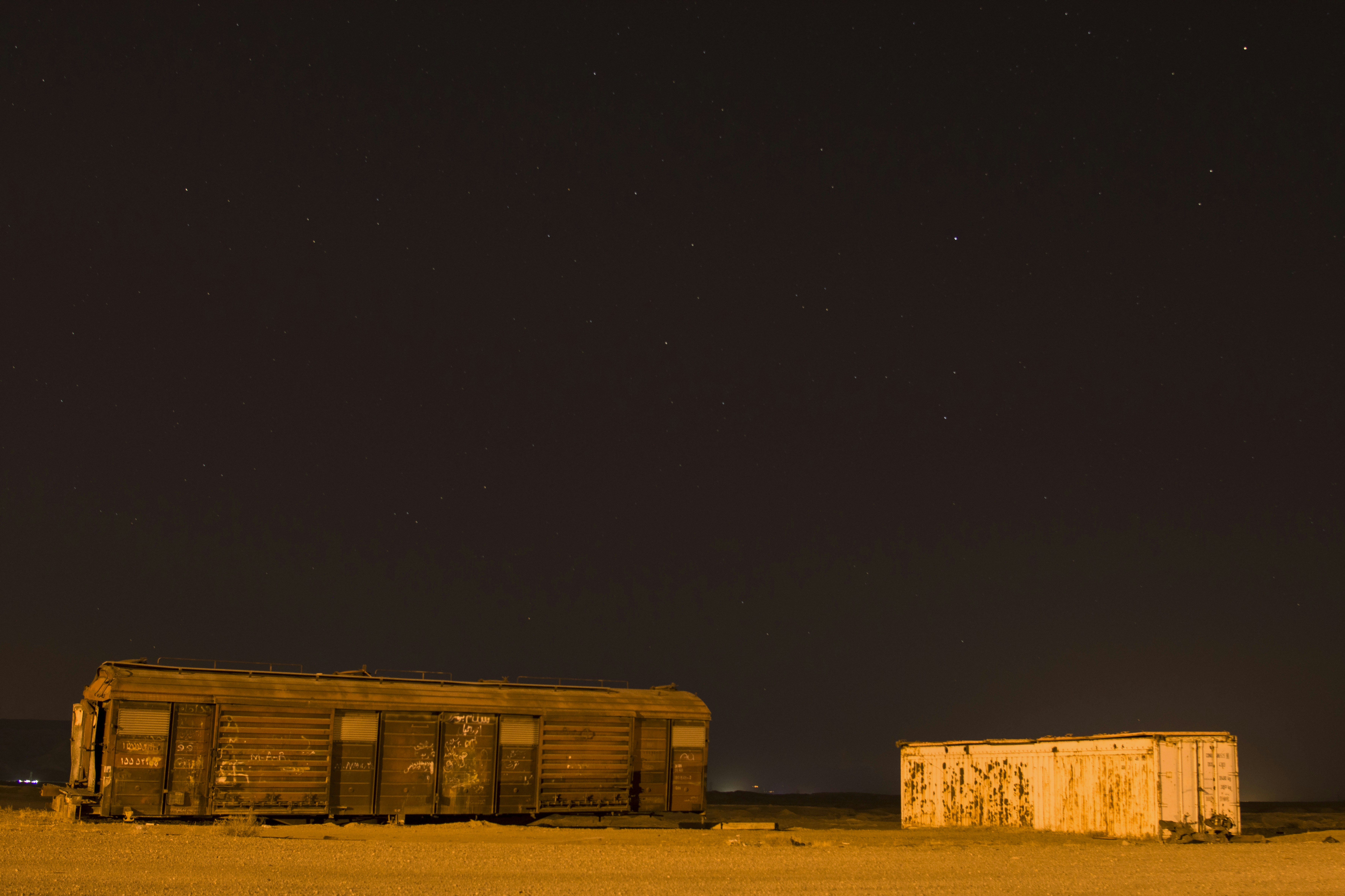 Deserted Railcars under a Starry Night