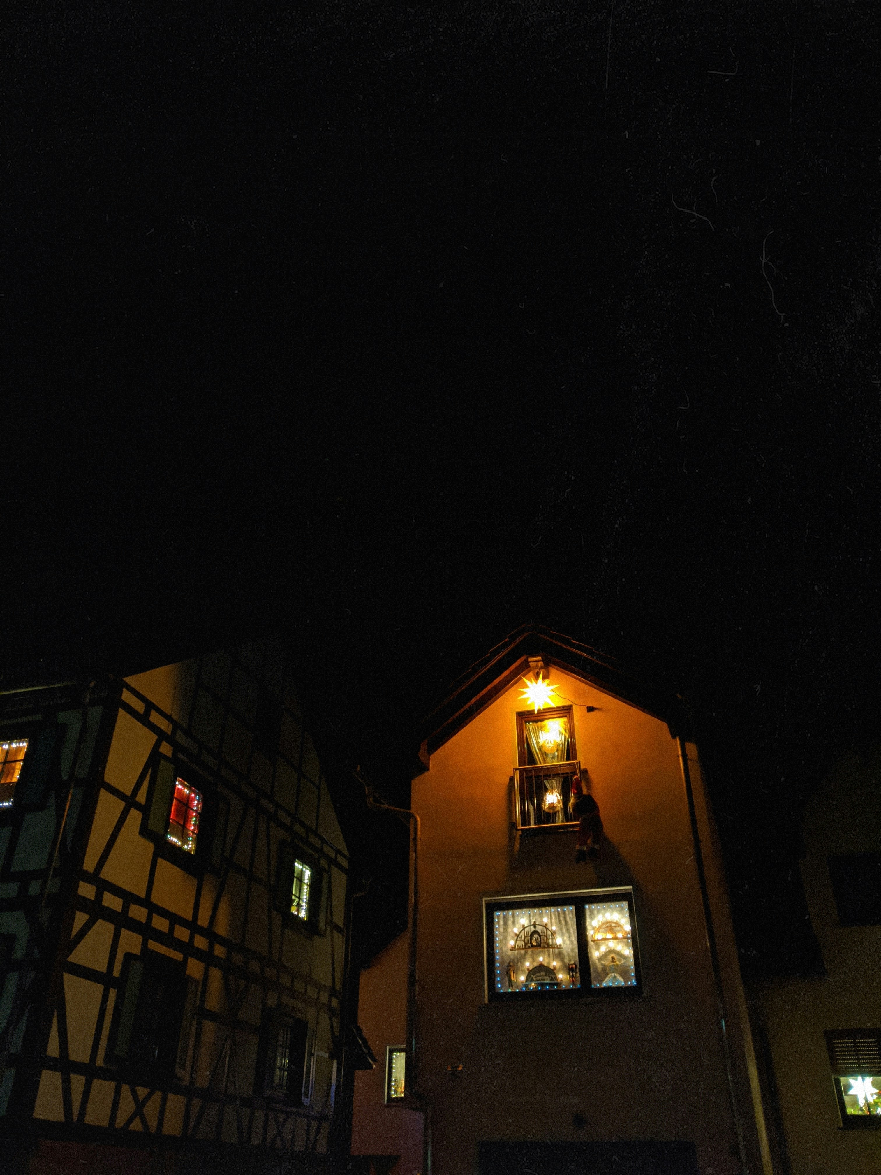 Gabled Night Beacon: Warm Window Lights in a Quiet Village