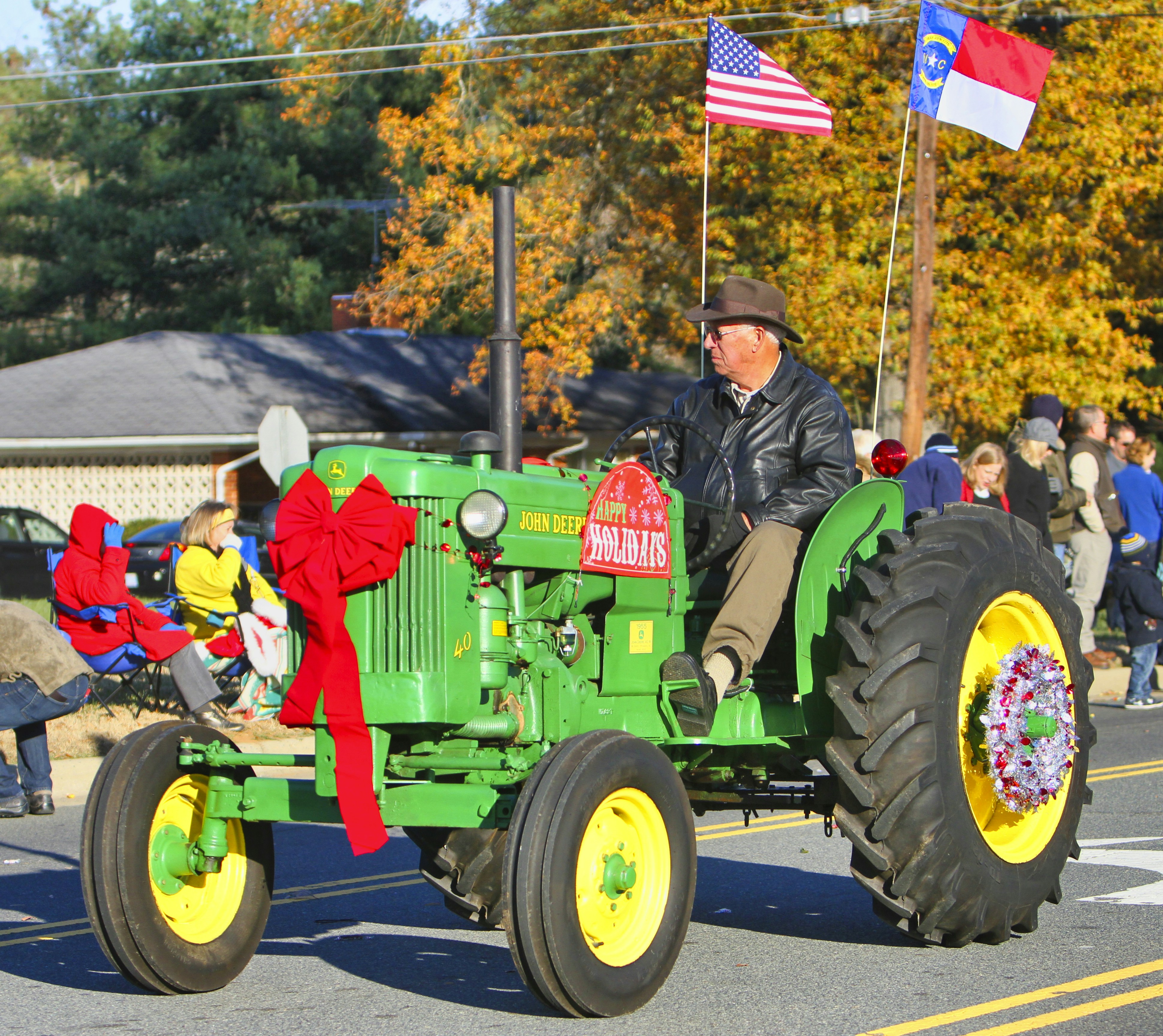Man in blue jacket riding green tractor during daytime photo – Free ...