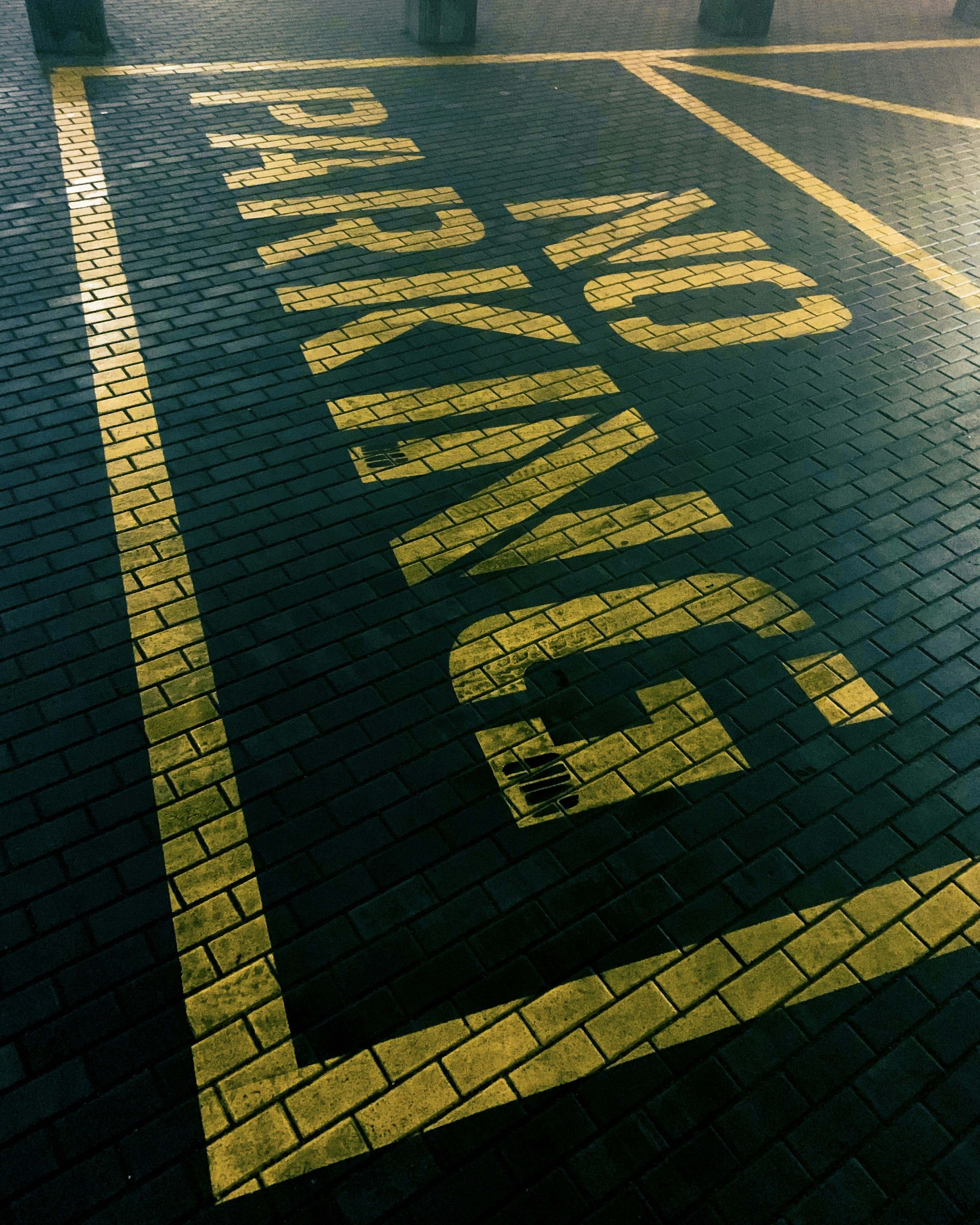 No Parking Diagonal: Sunlit Geometry on Cobblestones