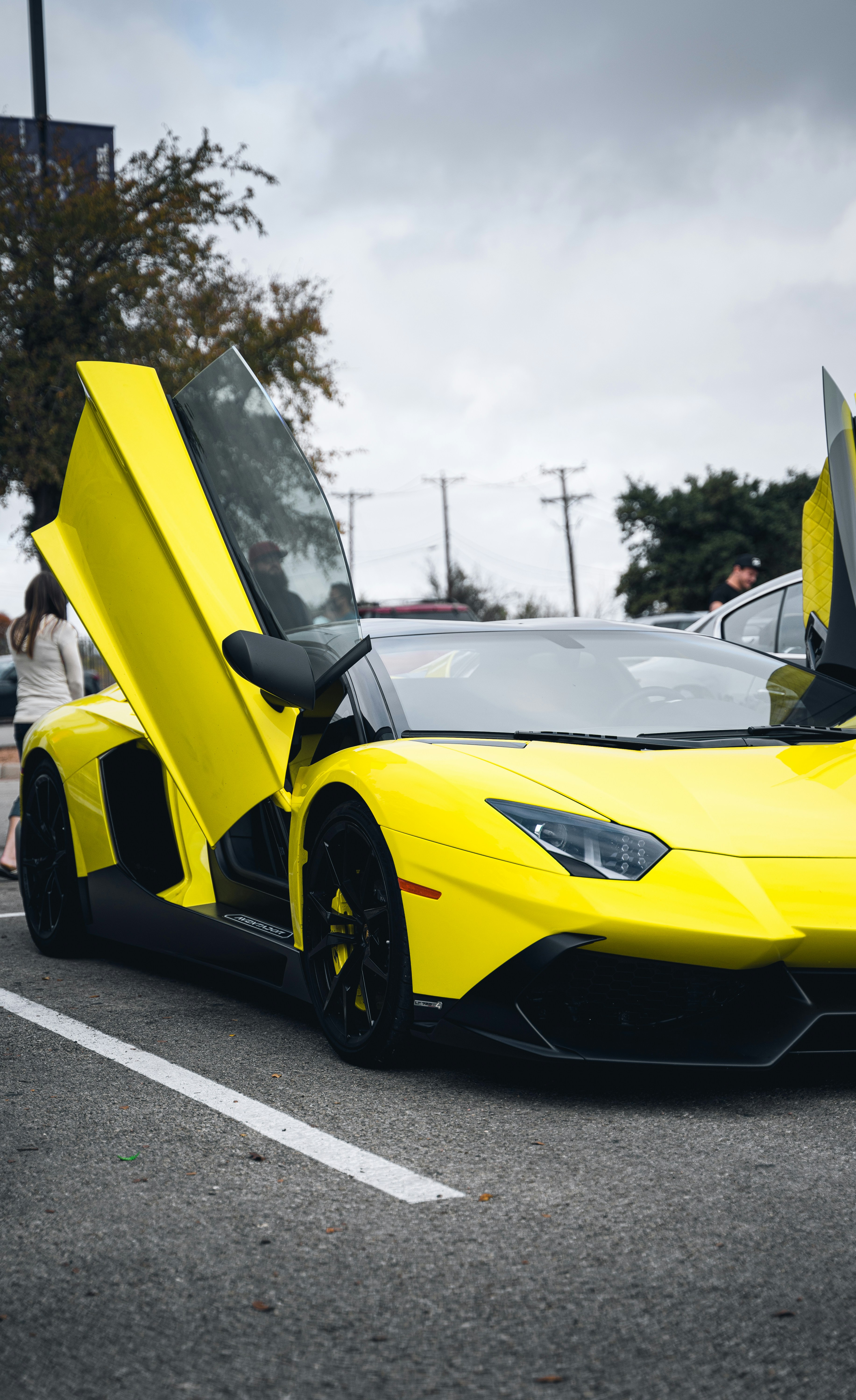 Yellow lamborghini aventador parked on gray asphalt road during daytime ...