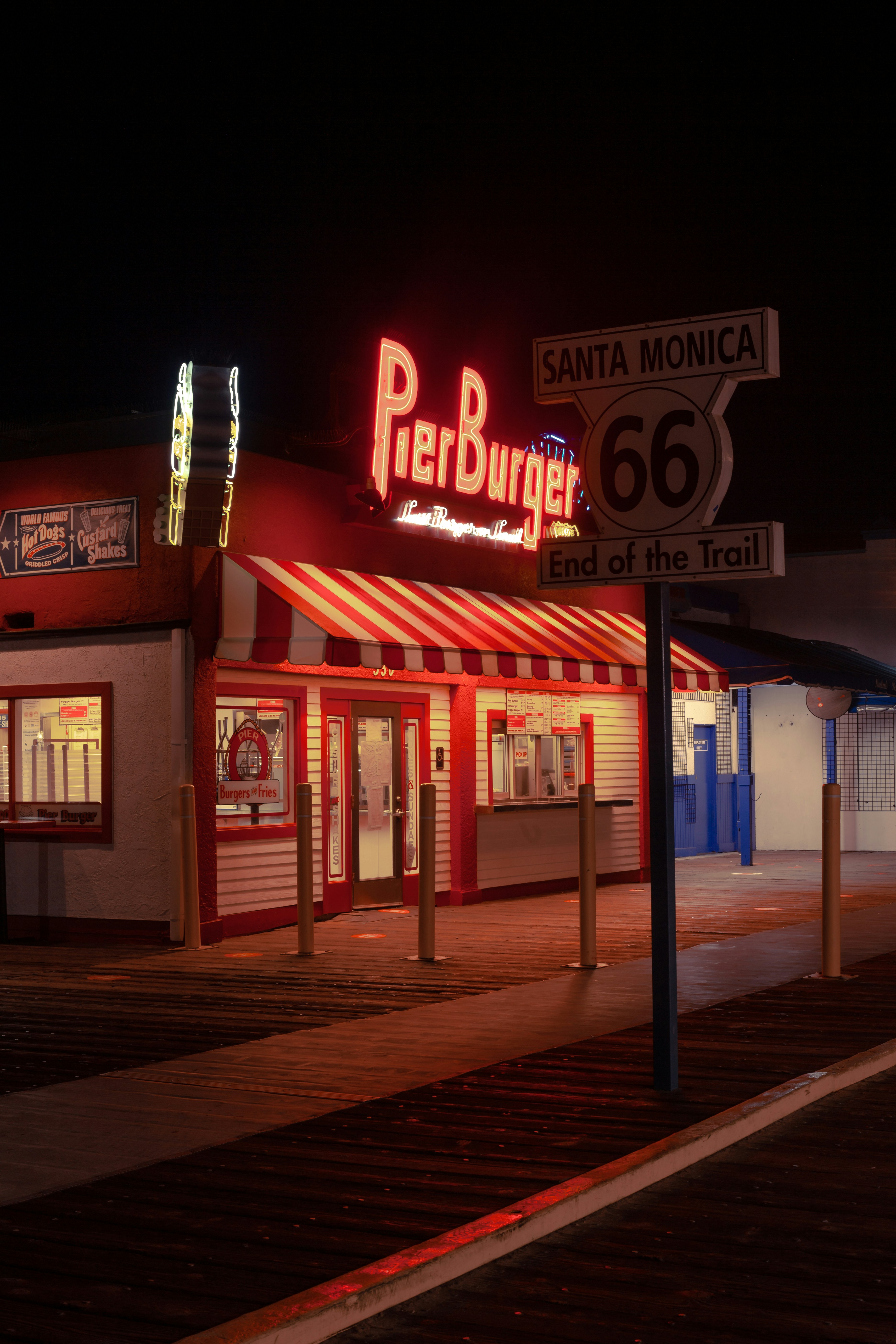 Red and white store front during night time photo – Free Food Image on ...