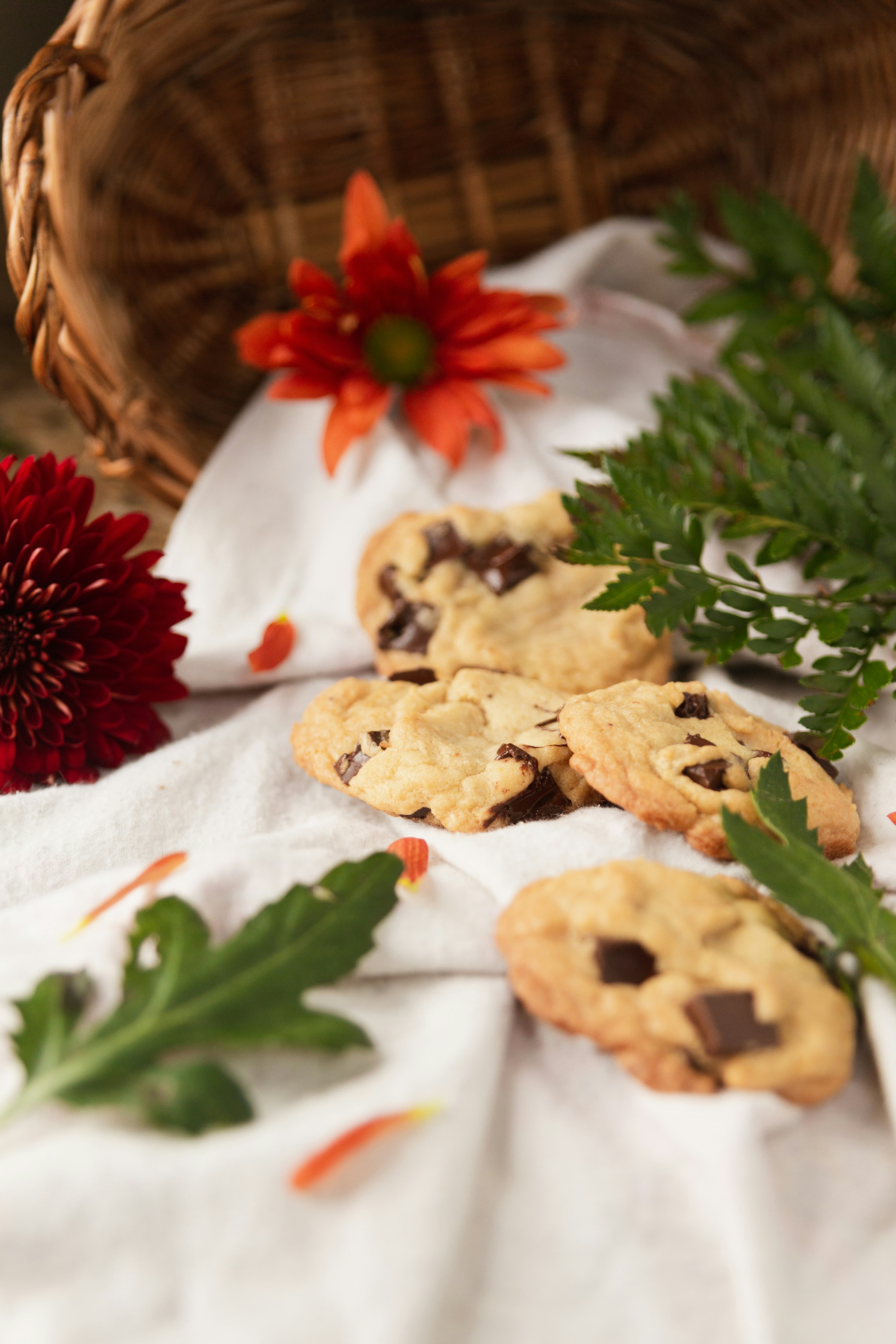 A Quiet Feast: Chocolate-Chip Cookies Framed by Florals and Linen