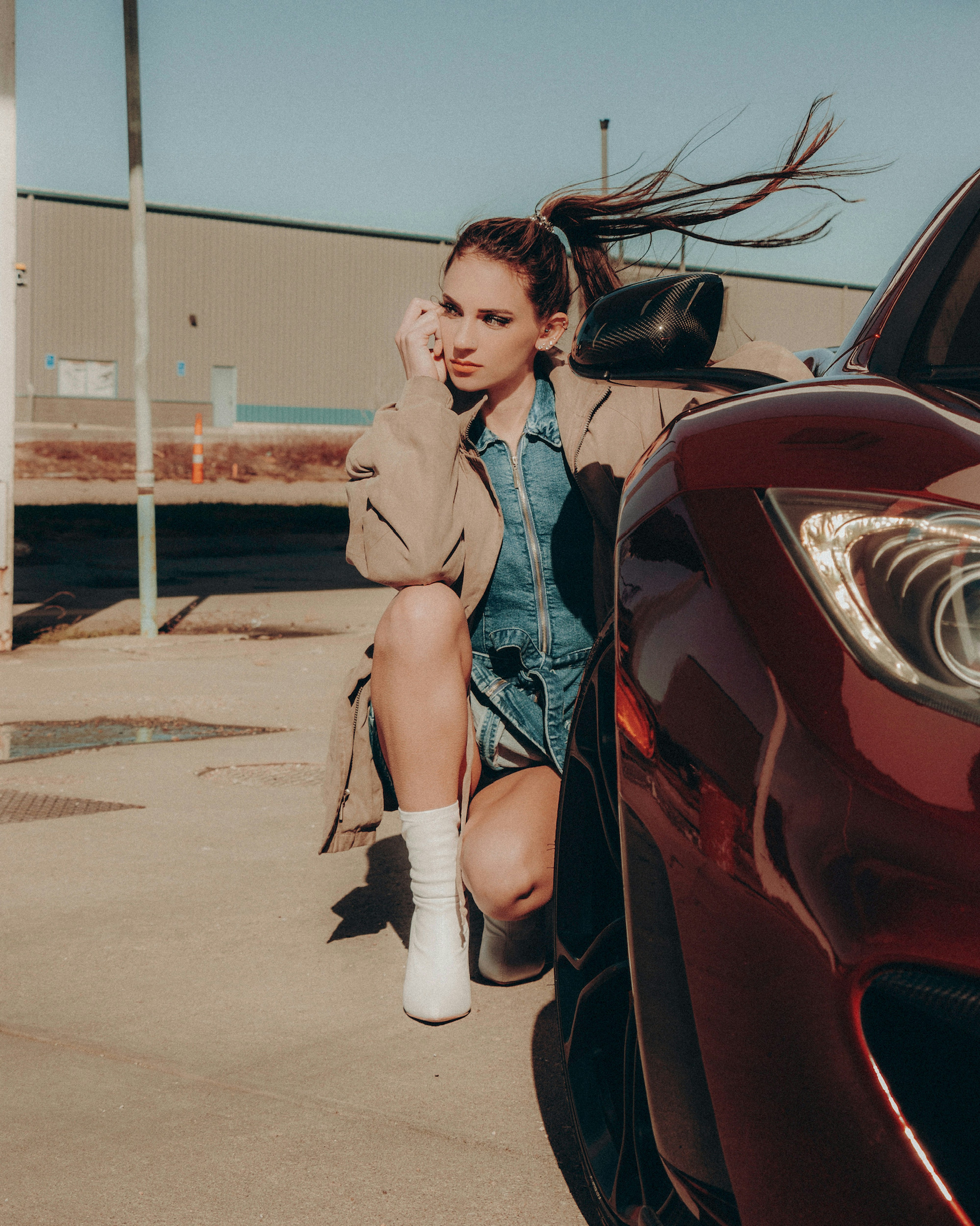 Woman in brown coat sitting on red car photo – Free Nebraska Image on ...