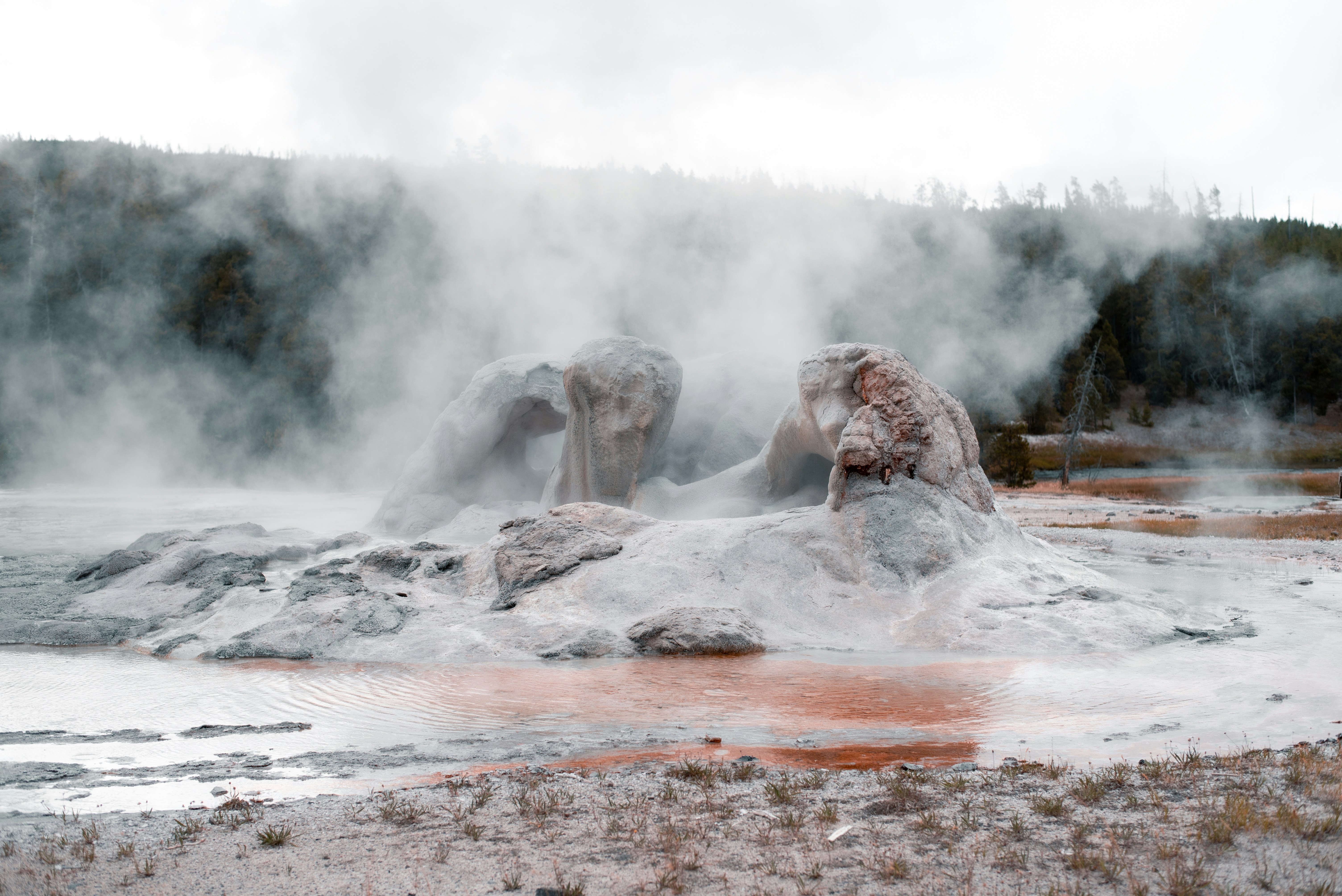 Steam Veil Over Eruptive Forms
