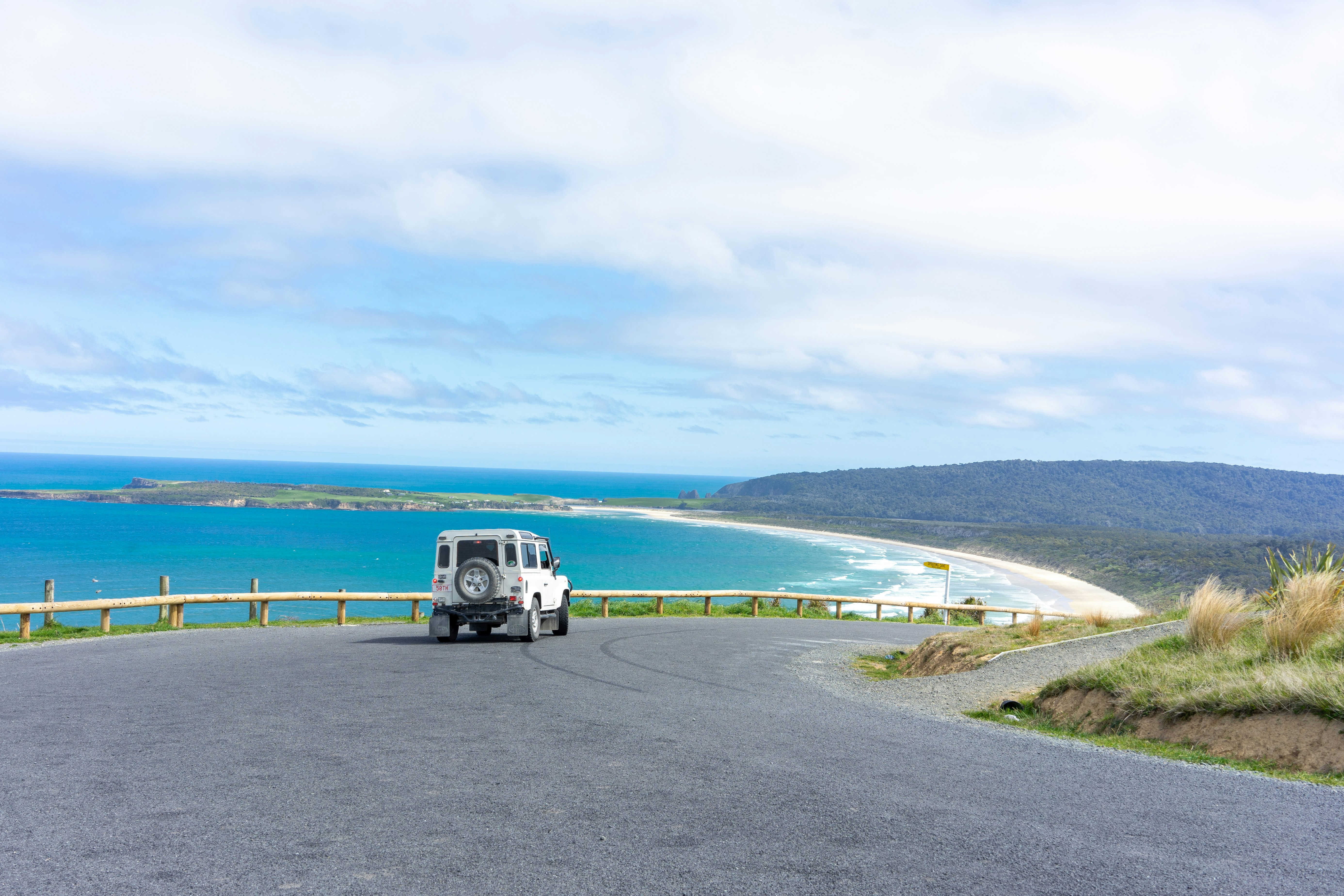 Coastal Curve: A Jeep Graces the Ocean-Front Road