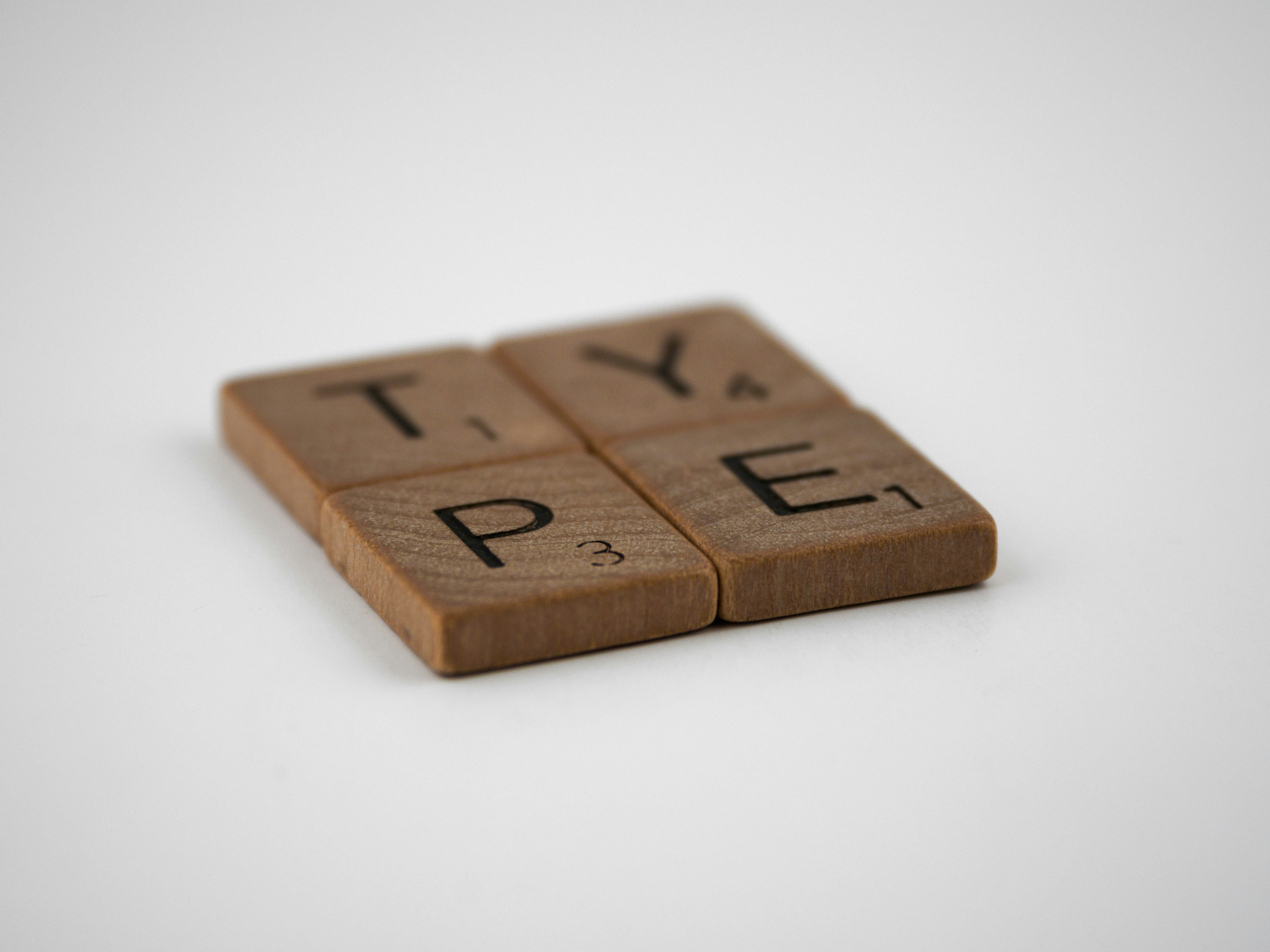 scrabble, scrabble pieces, lettering, letters, wood, scrabble tiles, white background, words, type, typography, design, layout, 
Brett Jordan