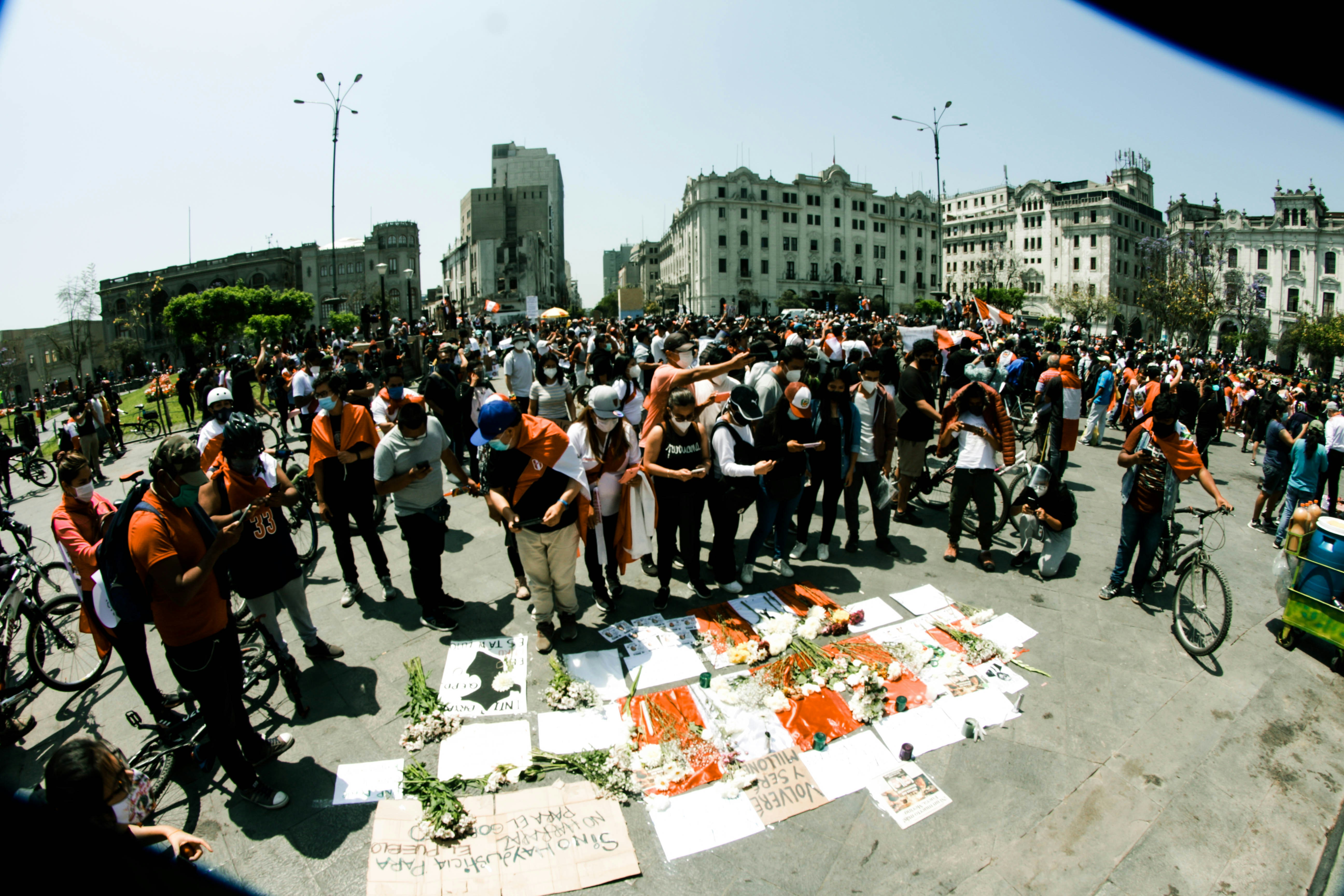 people standing on gray concrete pavement during daytime