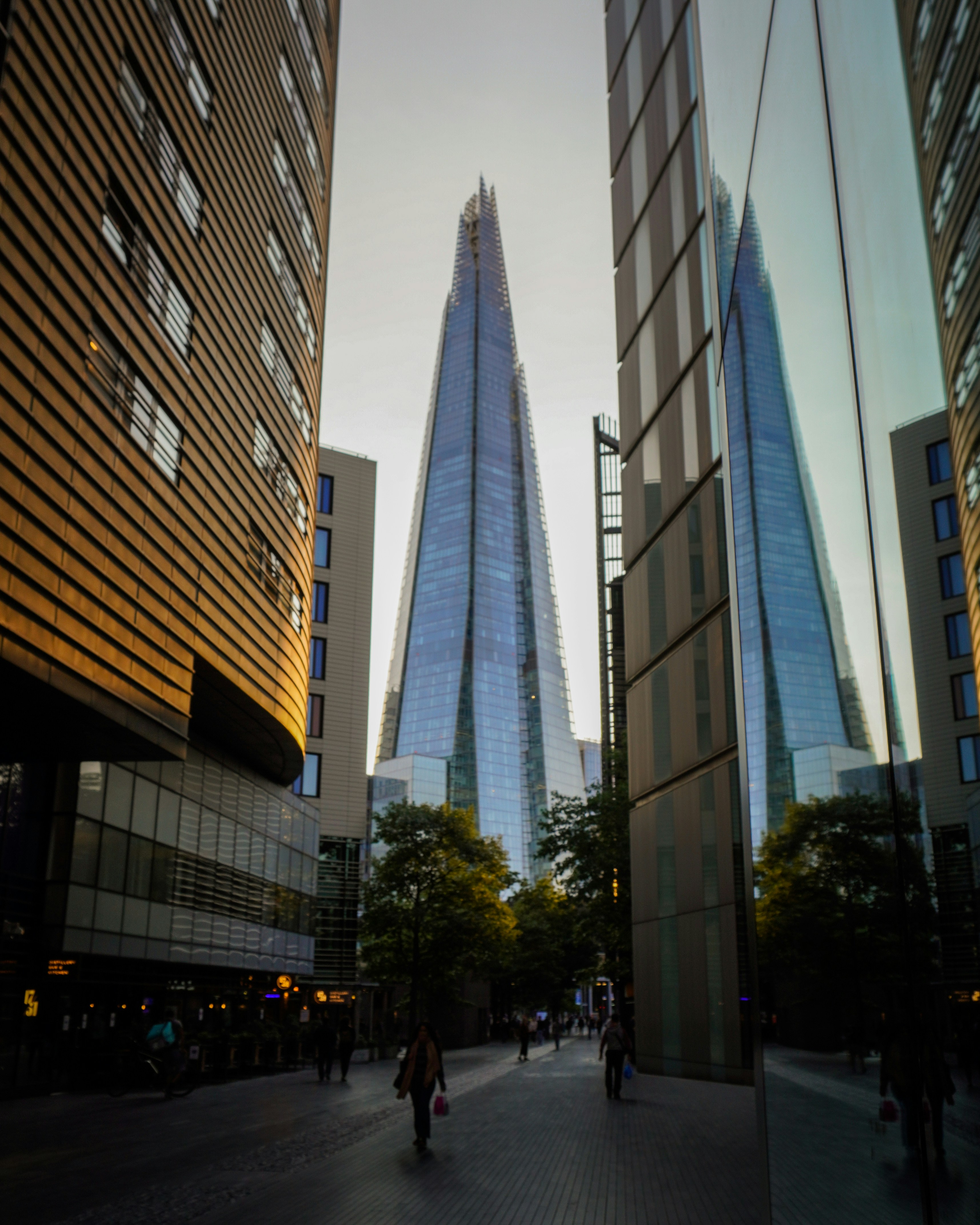 People walking on street near high rise building during daytime photo ...