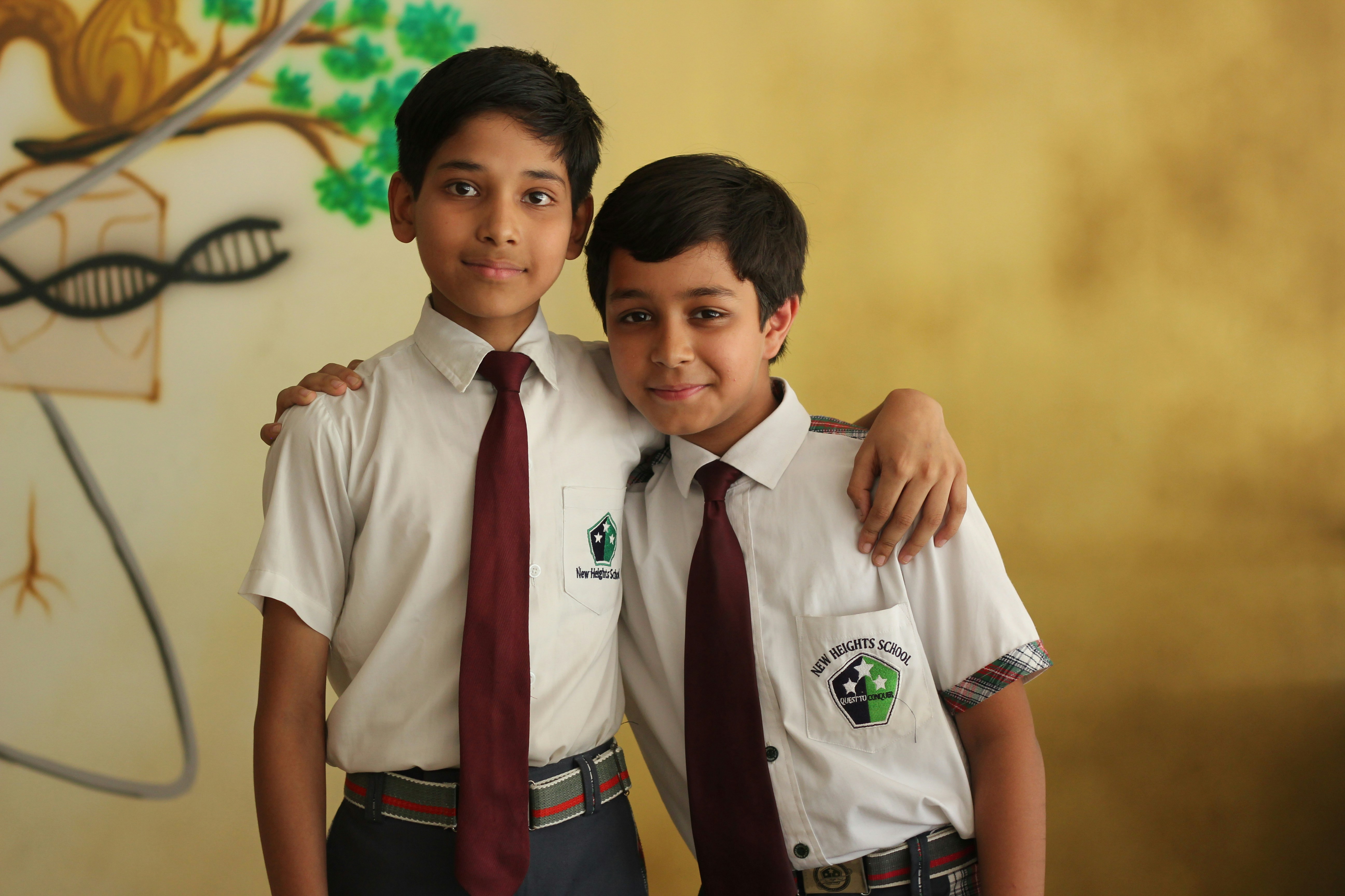2 boys in school uniform standing photo – Free Human Image on Unsplash
