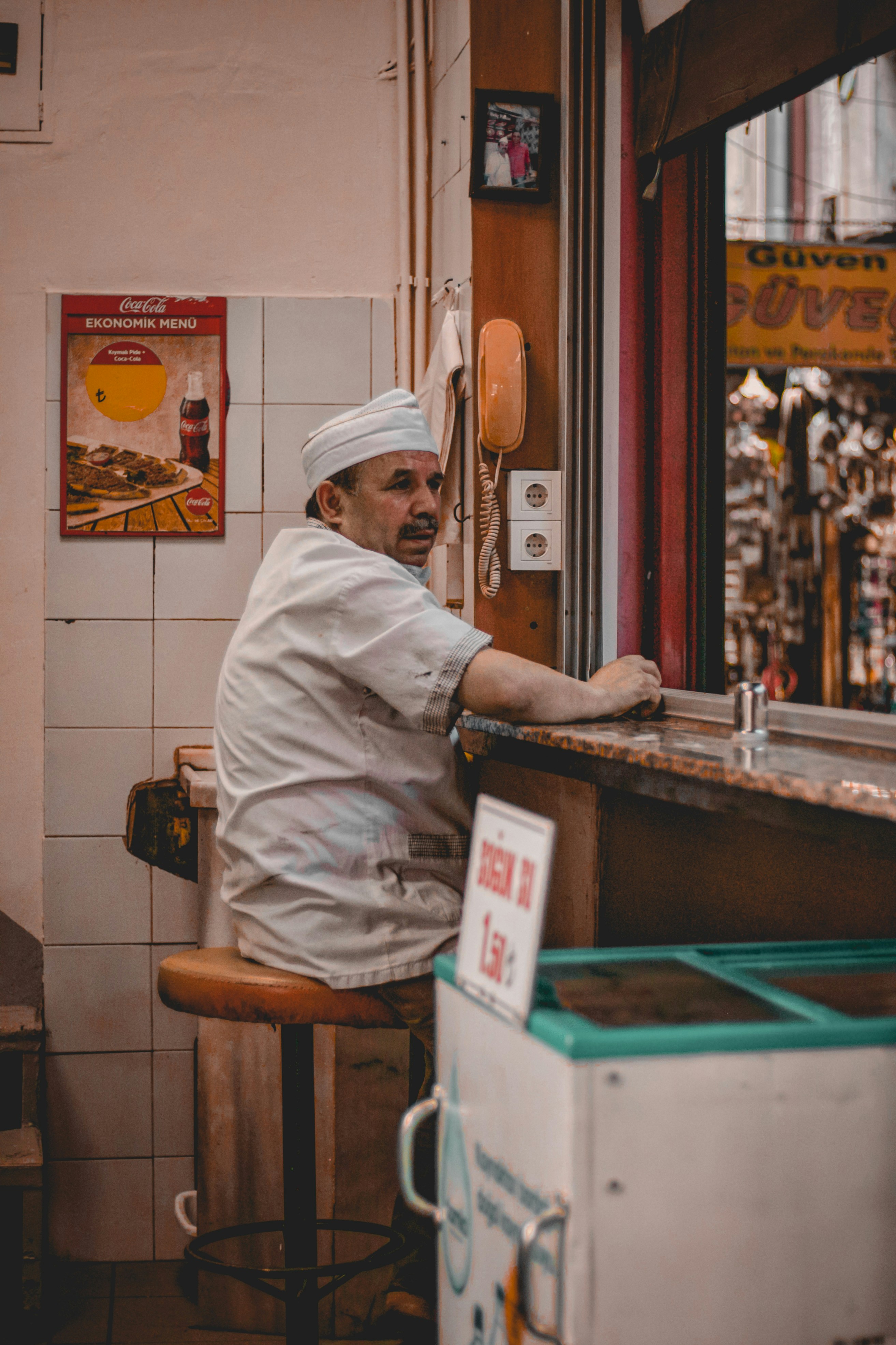 A Quiet Moment Behind the Counter: A Chef in a Turkish Diner