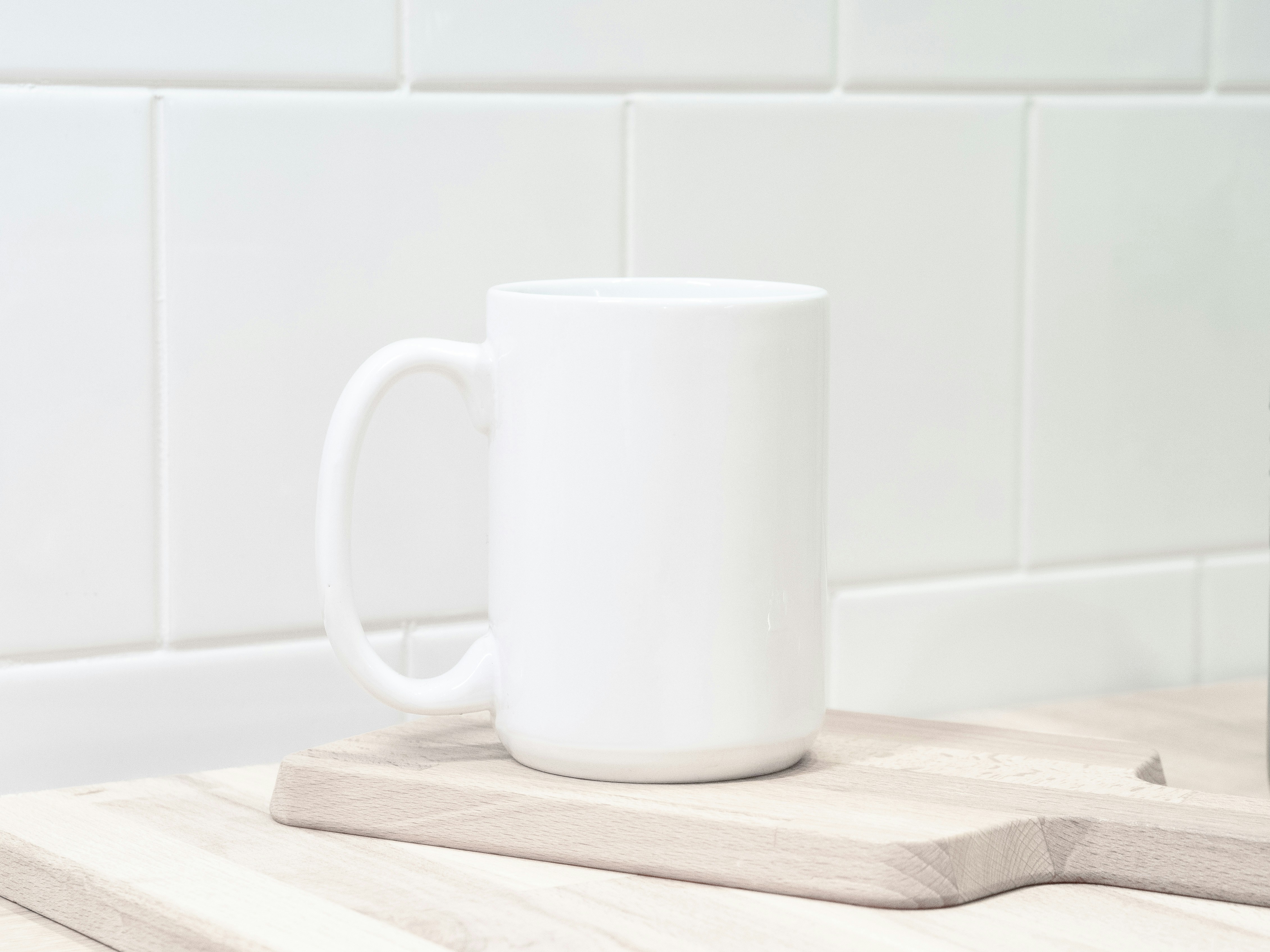 White ceramic mug on brown wooden chopping board photo – Free Grey ...