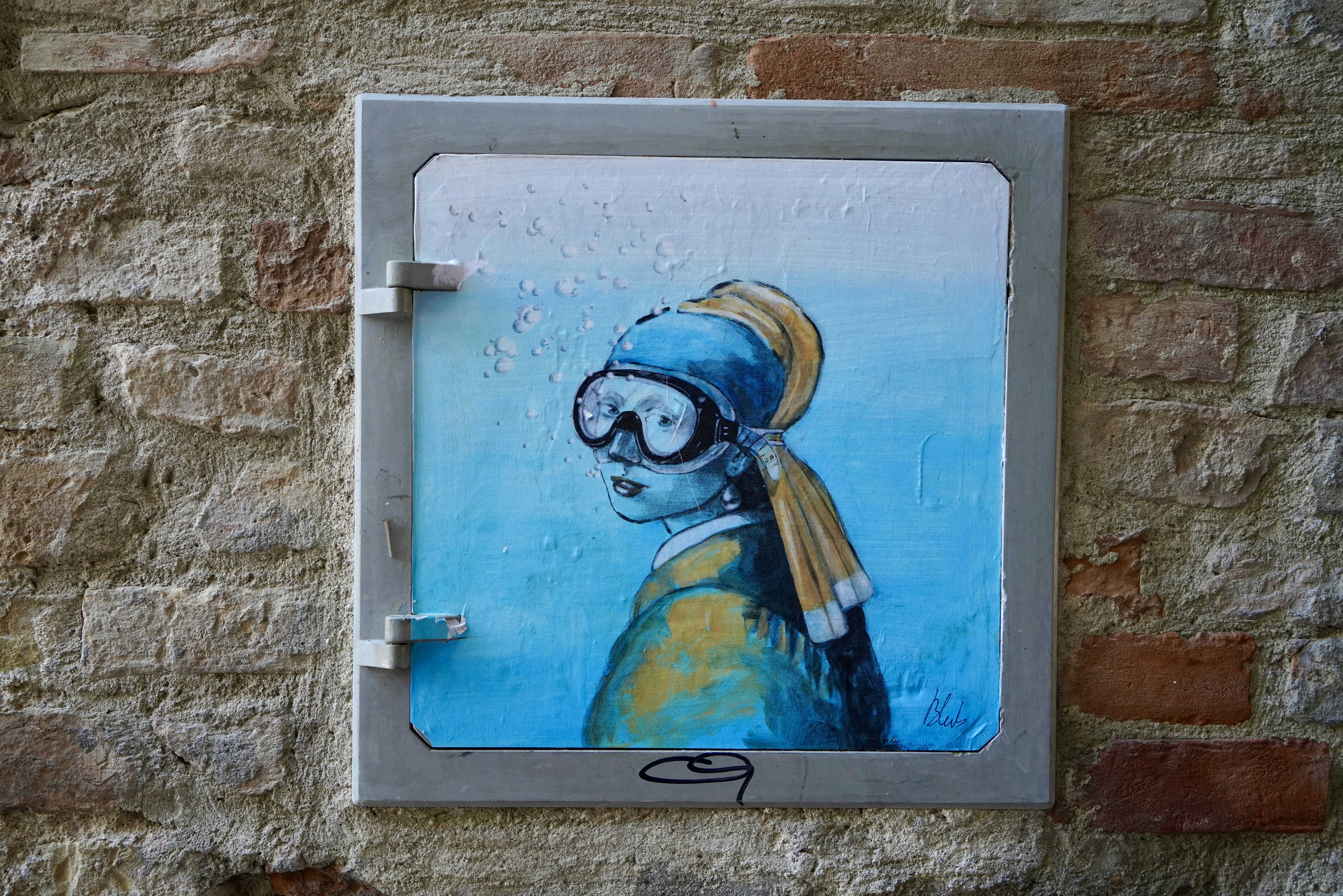 Diver in a Blue Window: A Street Portrait of Quiet Adventure