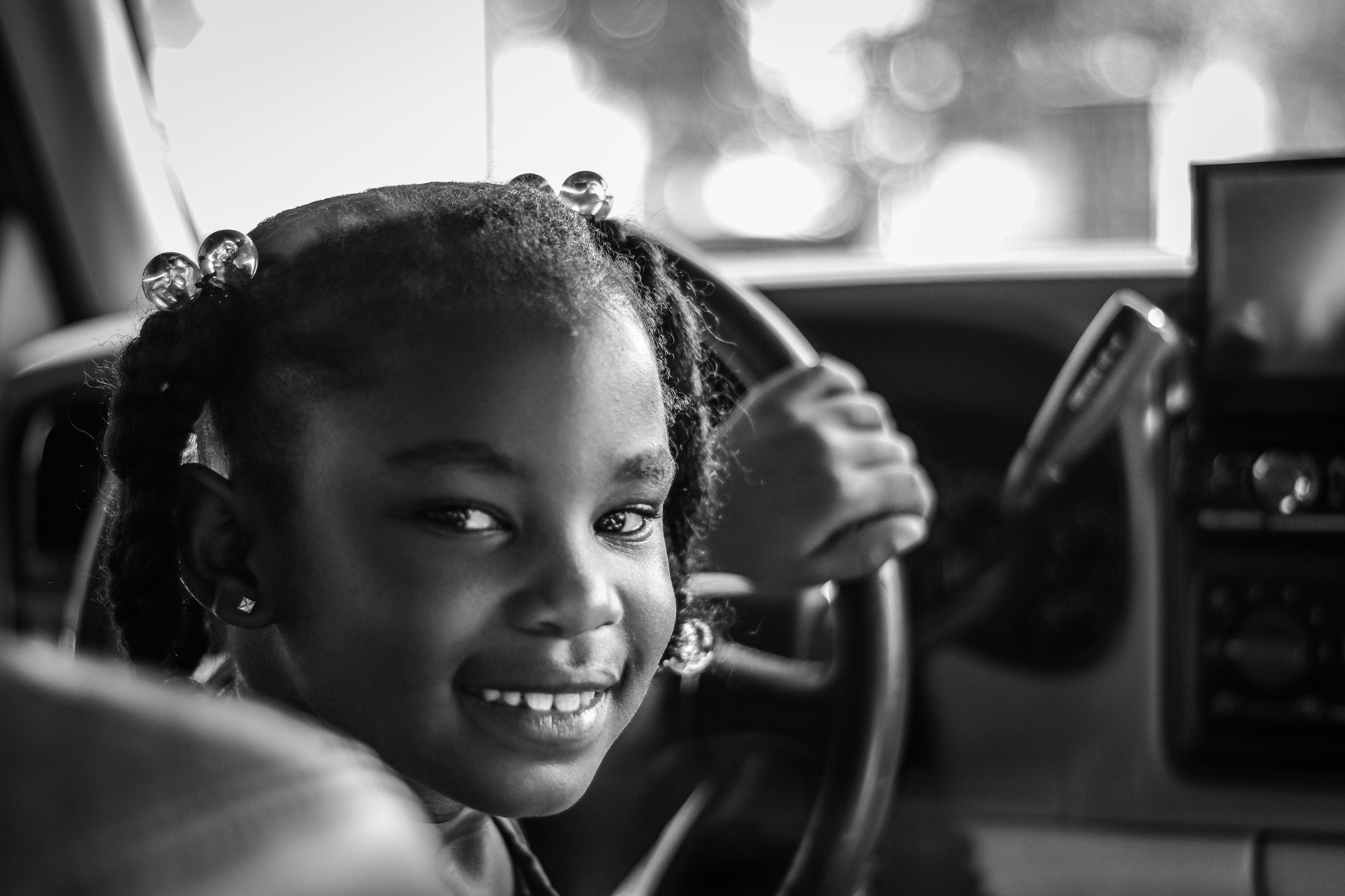 Smiling Driver: A Girl at the Wheel