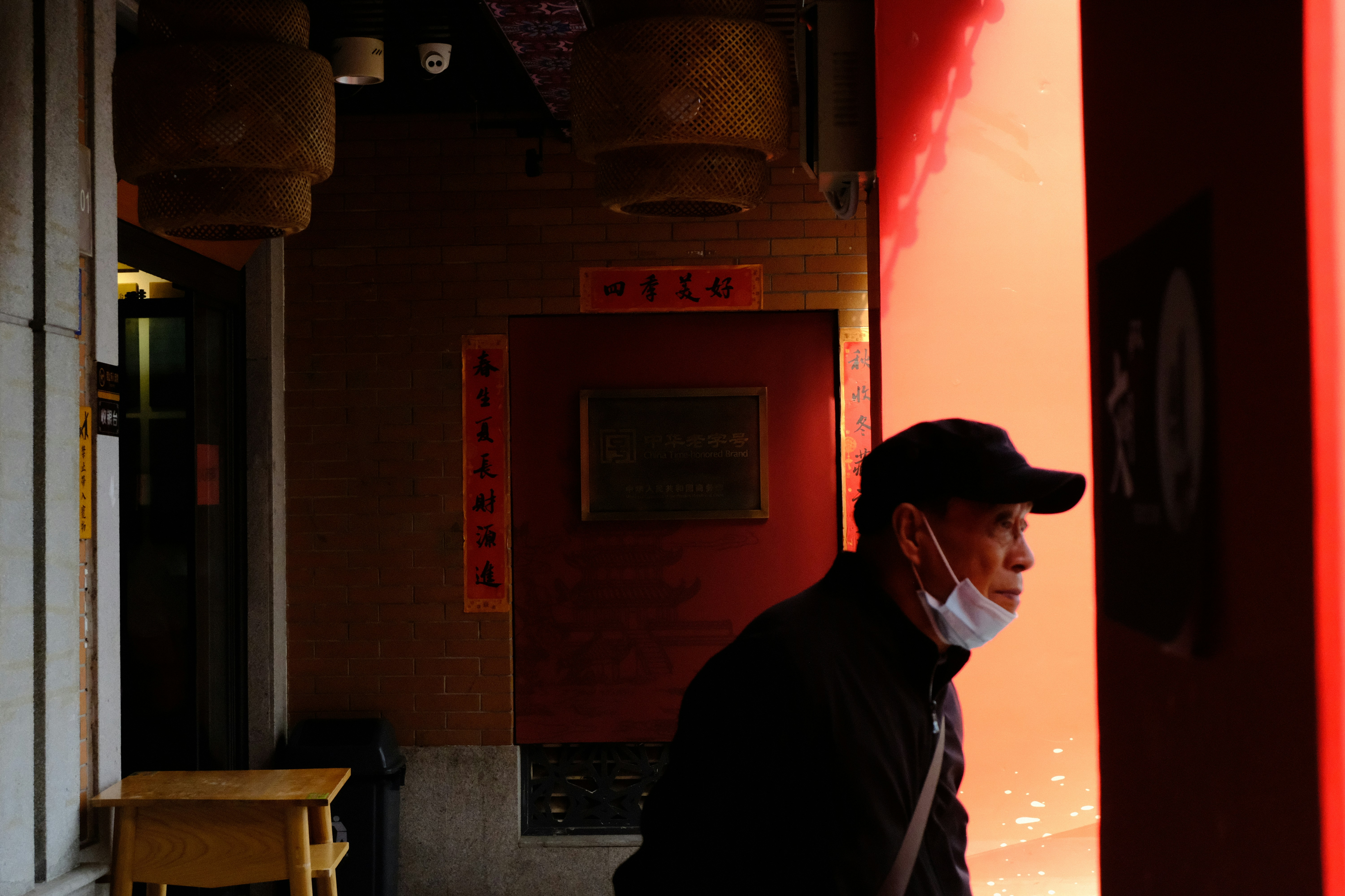 man in black jacket and black cap