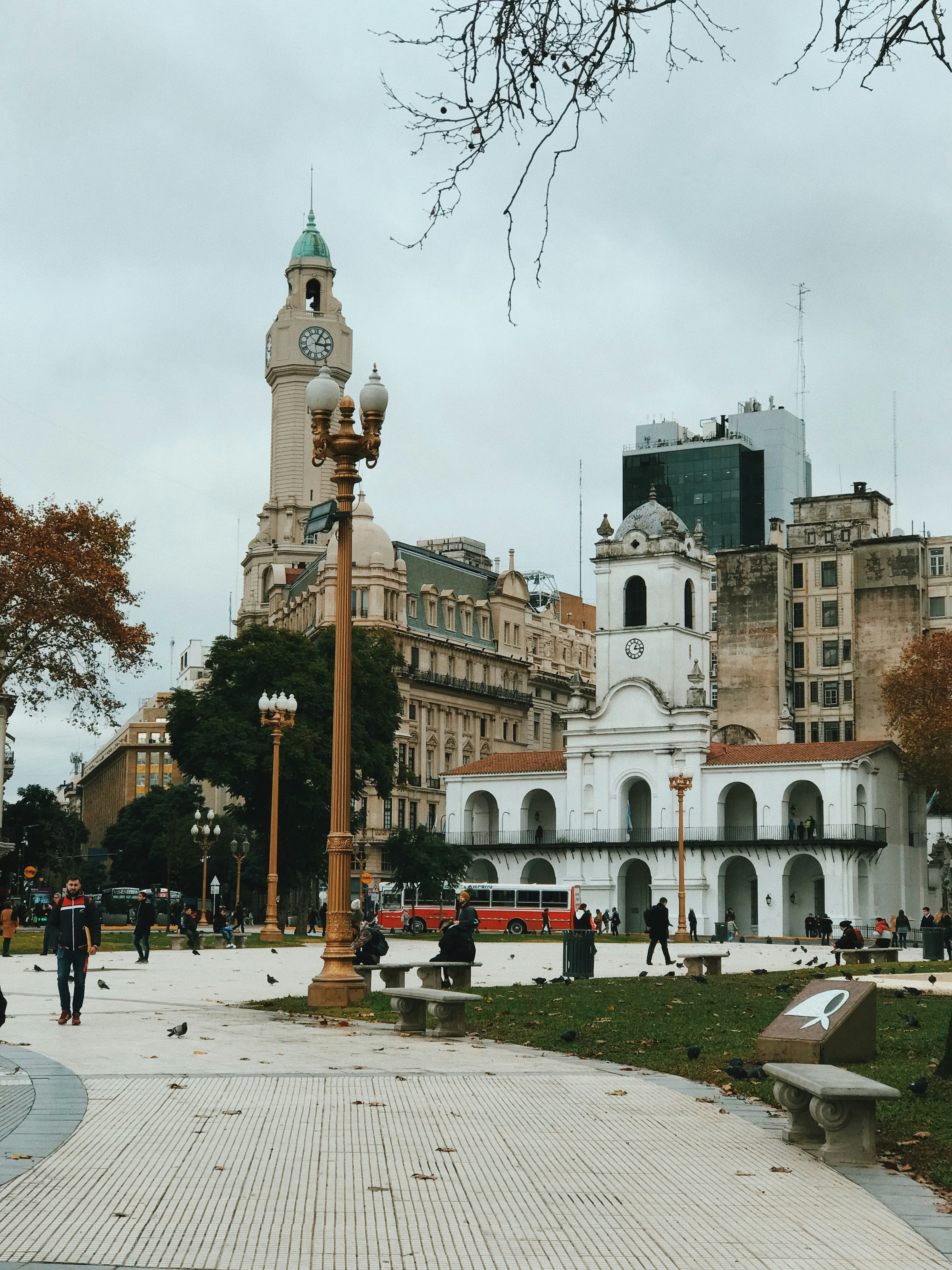 City Clocktower and Arcaded White Facade: A Morning in the Plaza