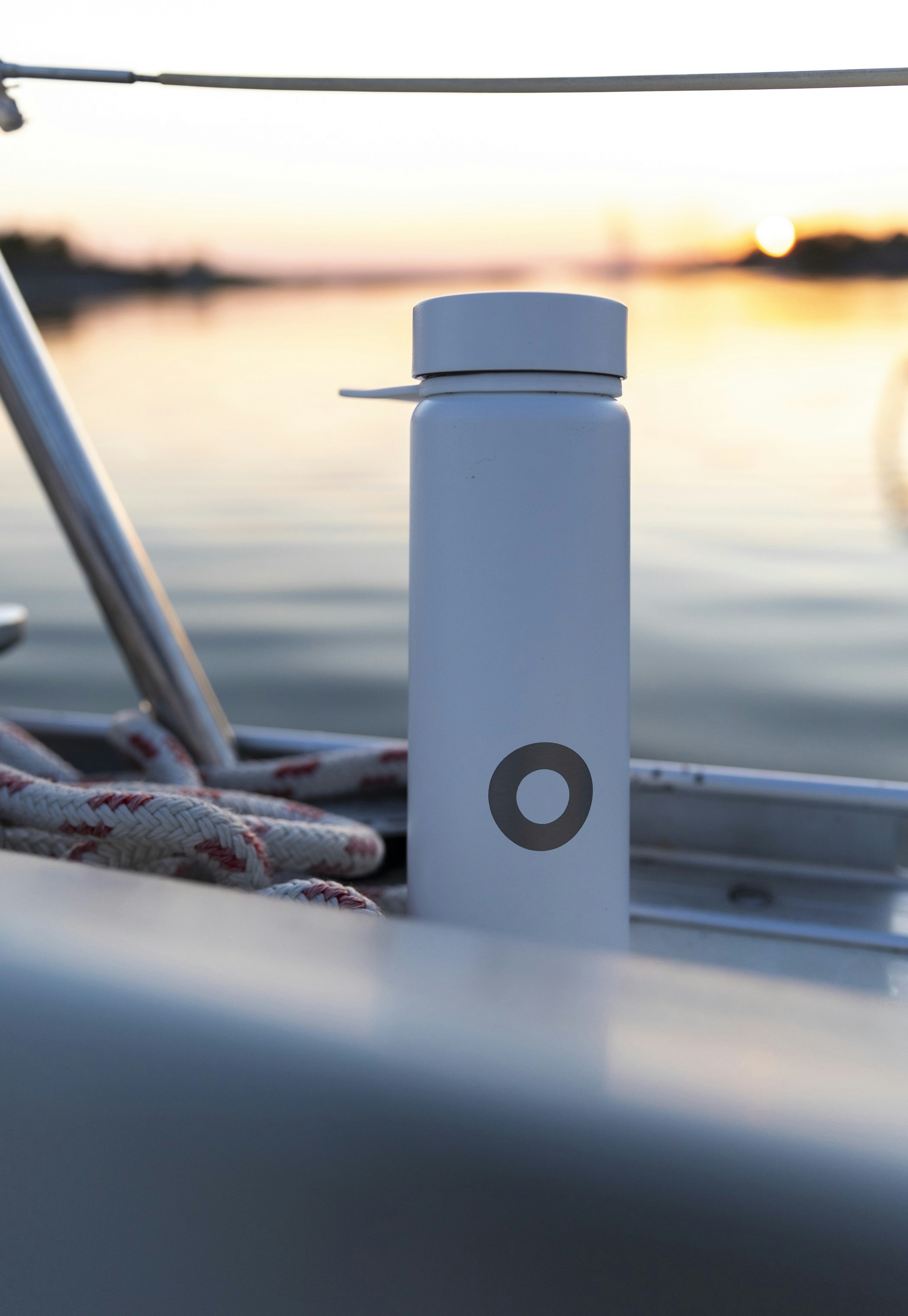 Hydration at Sunset: A Minimalist Bottle Anchors the Boat