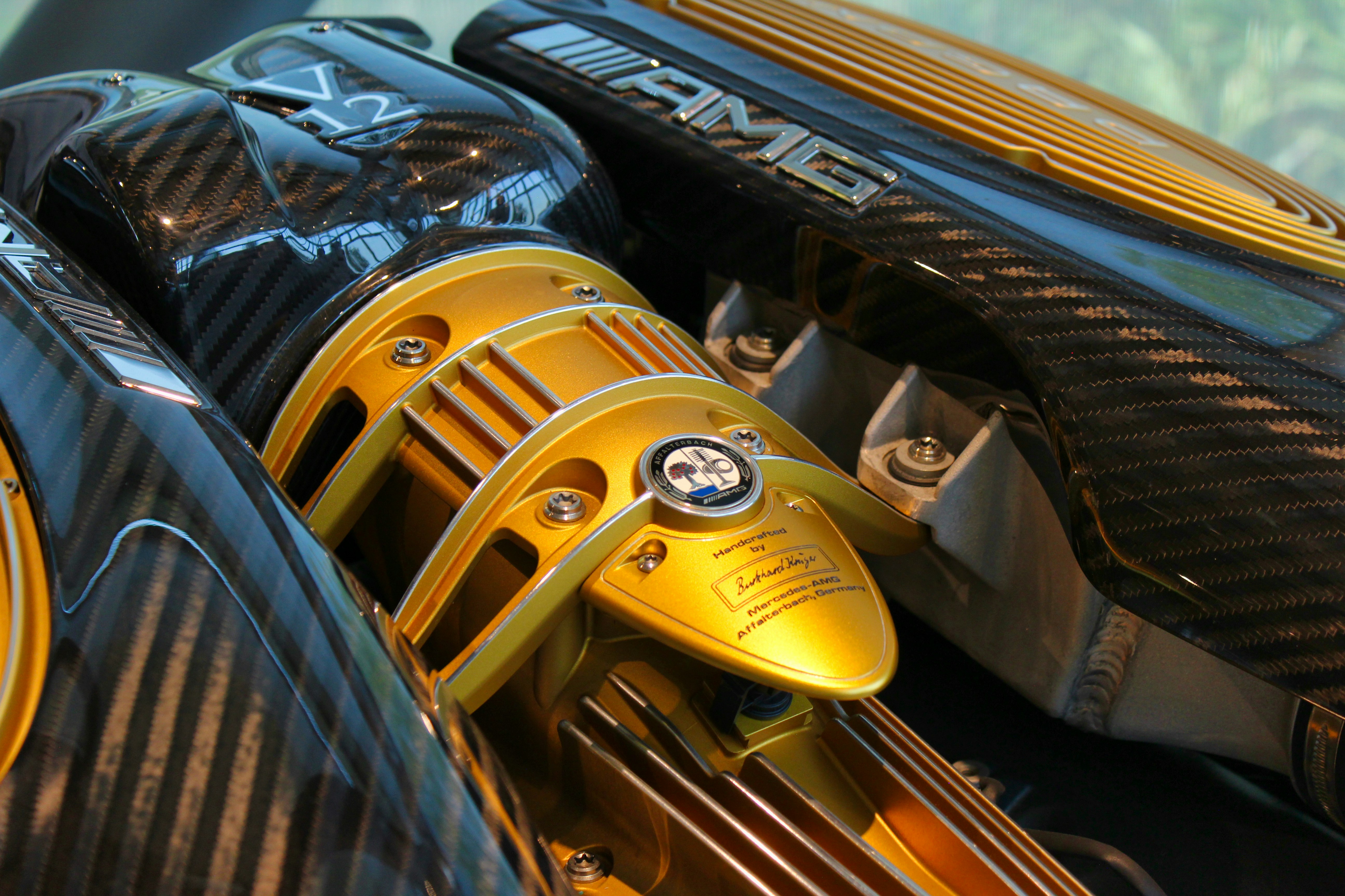 Gilded Precision: Carbon Fiber Meets AMG Gold in a Close-Up Engine Bay